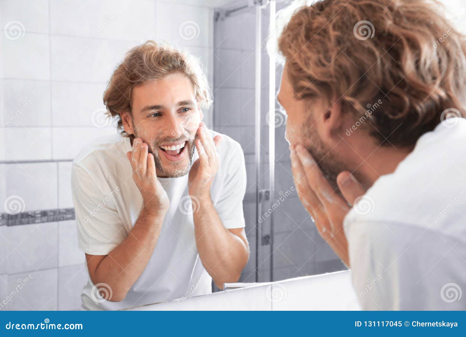 Young Man Washing Face With Soap Near Mirror Stock Image Image Of