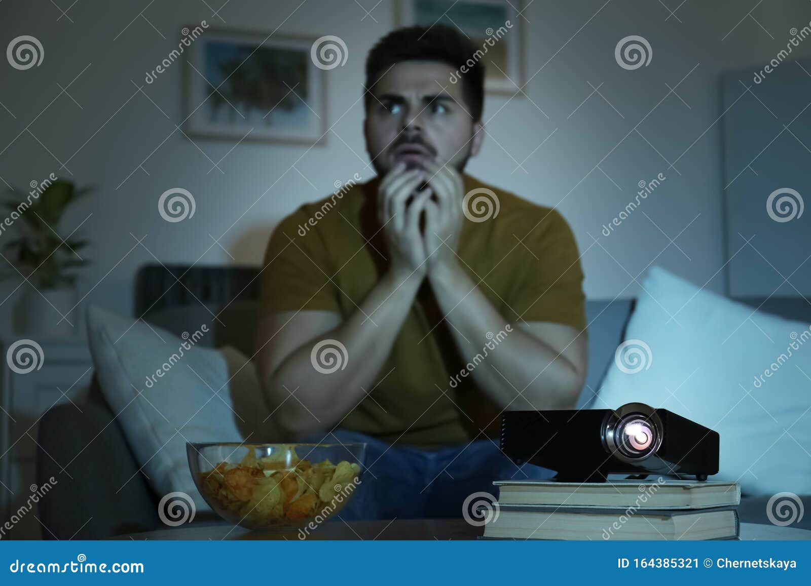 Man Watching Movie at Home, Focus on Video Projector Stock Image ...