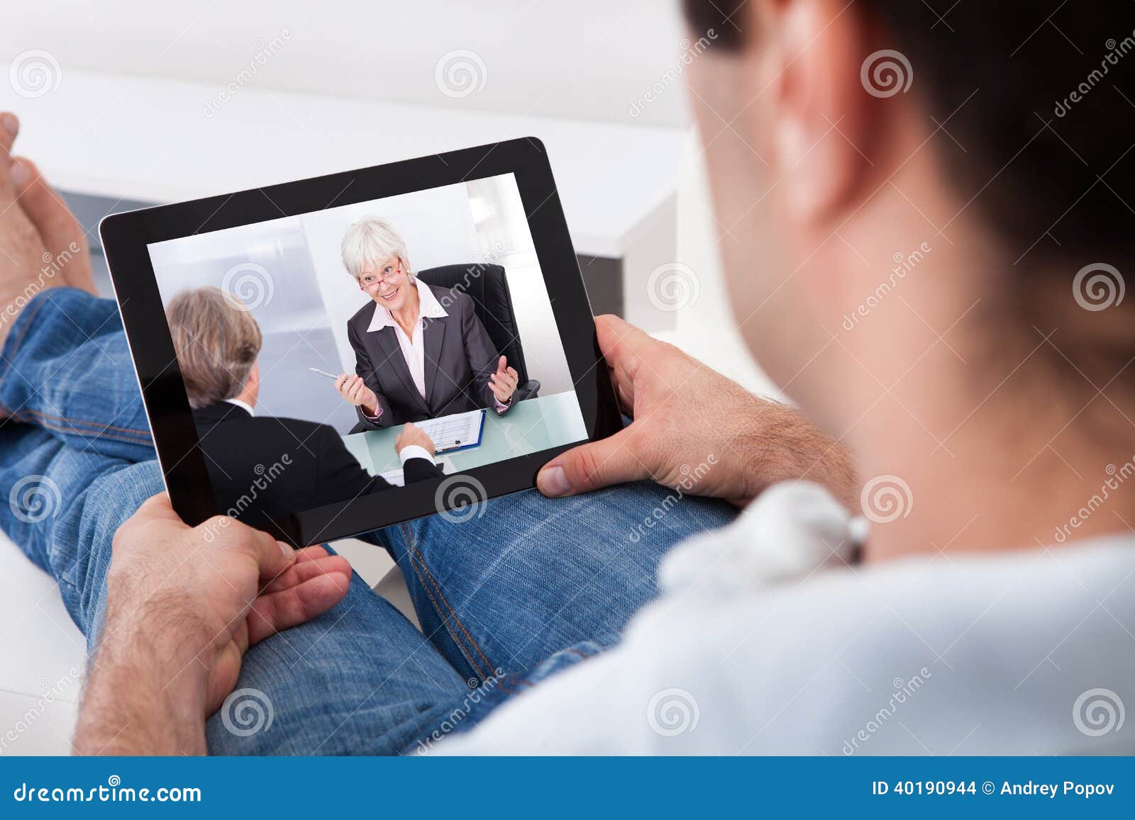 Young Man Watching Movie on Tablet Pc Stock Photo - Image of ...