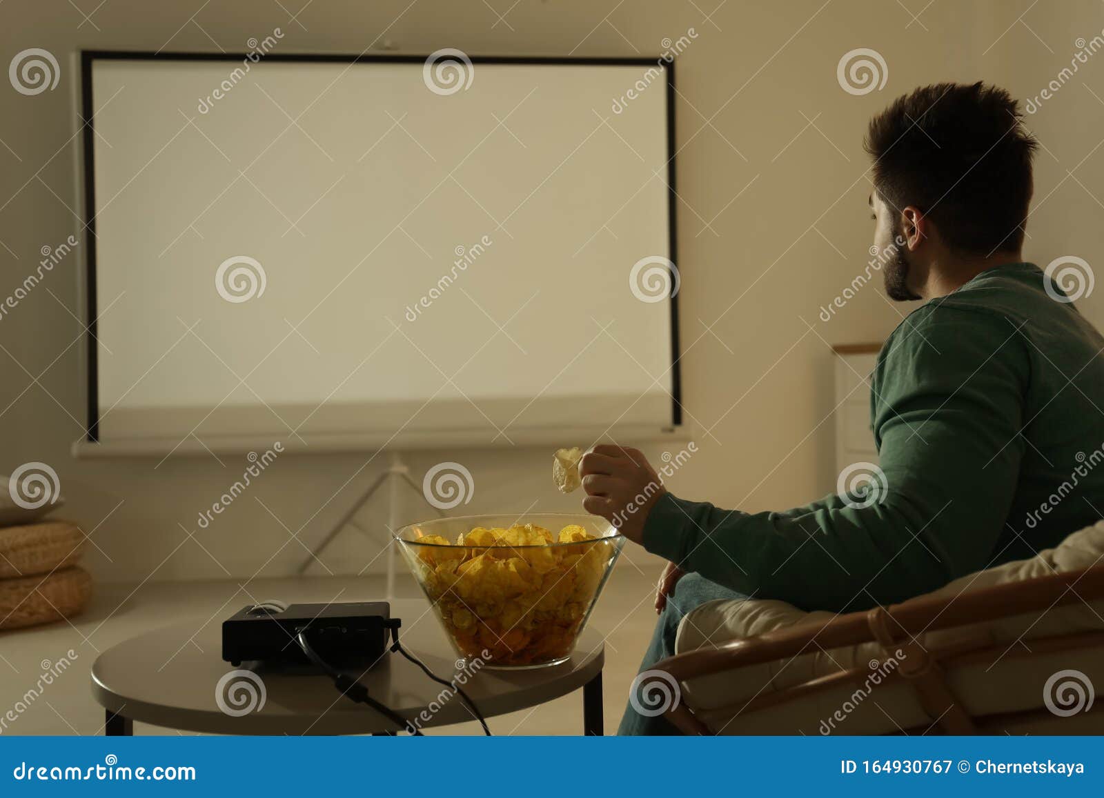 Young Man Watching Movie Using Video Projector Stock Image - Image of ...