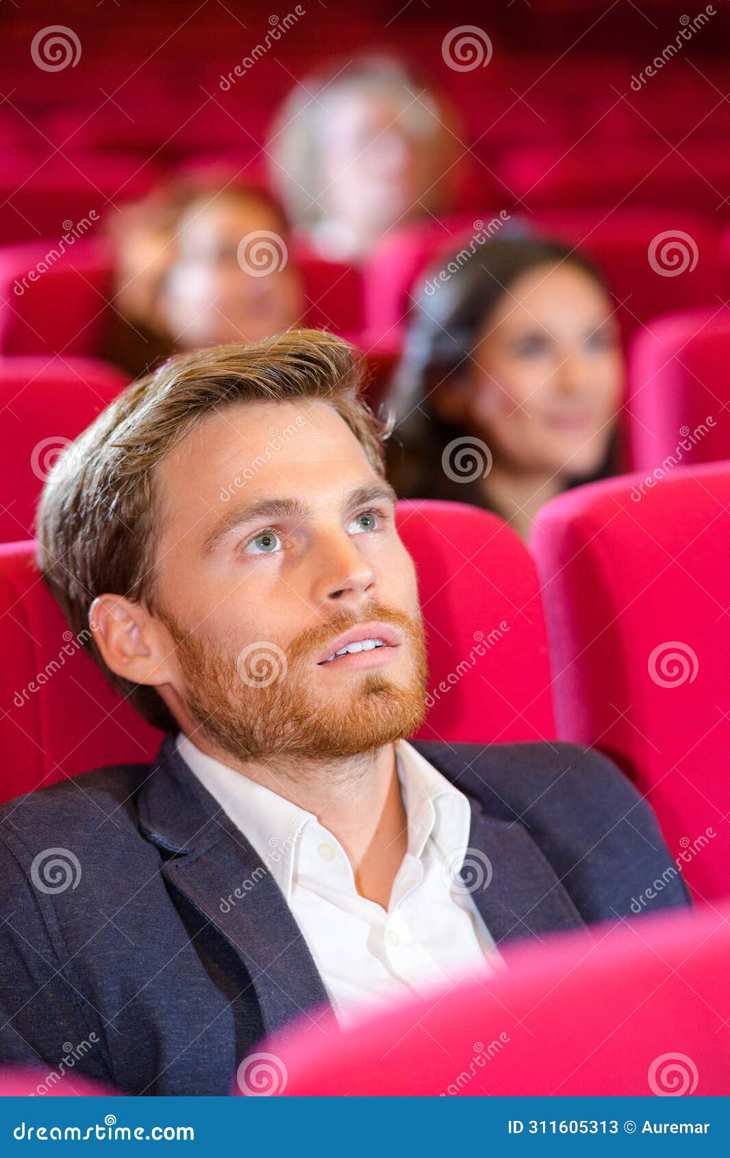 Young man watching movies stock image. Image of enjoying - 311605313