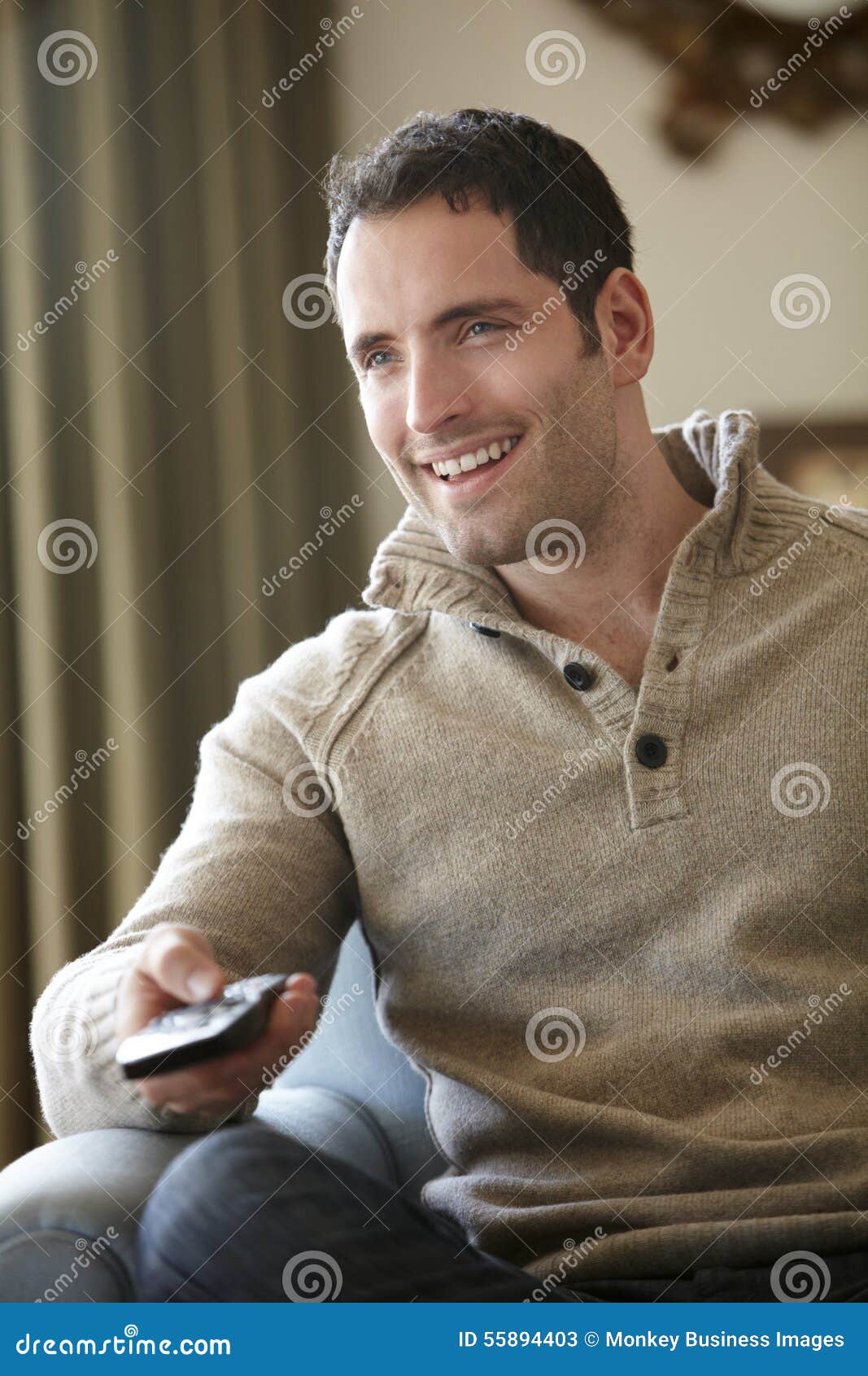 Young Man Watching Television at Home Stock Image - Image of smiling ...