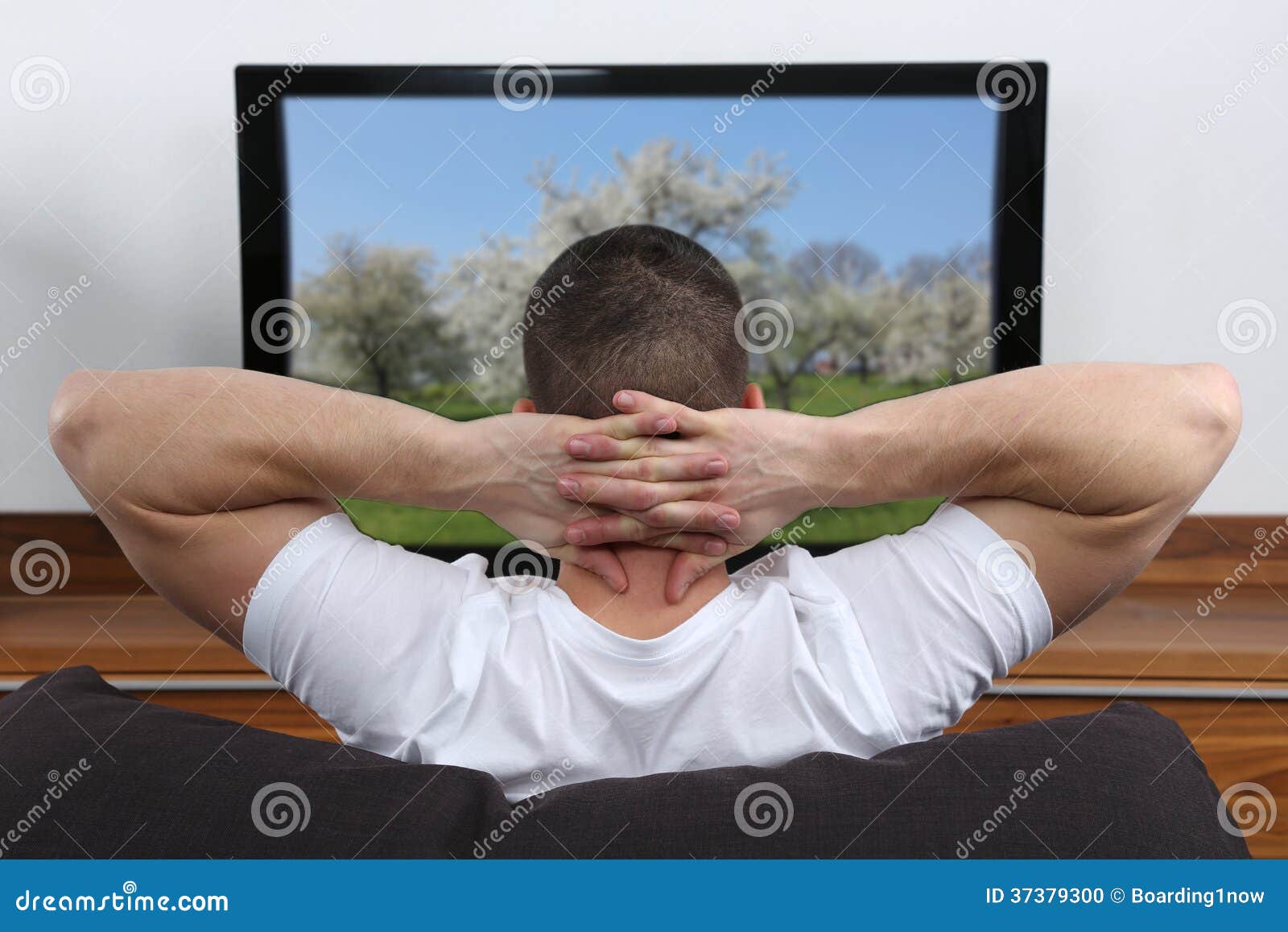 Young man watching tv stock photo. Image of films, sofa - 37379300