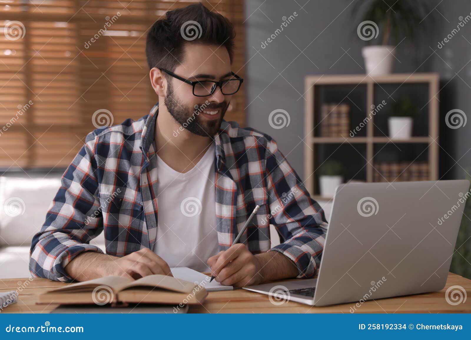 Young Man Watching Webinar at Table in Room Stock Photo - Image of ...