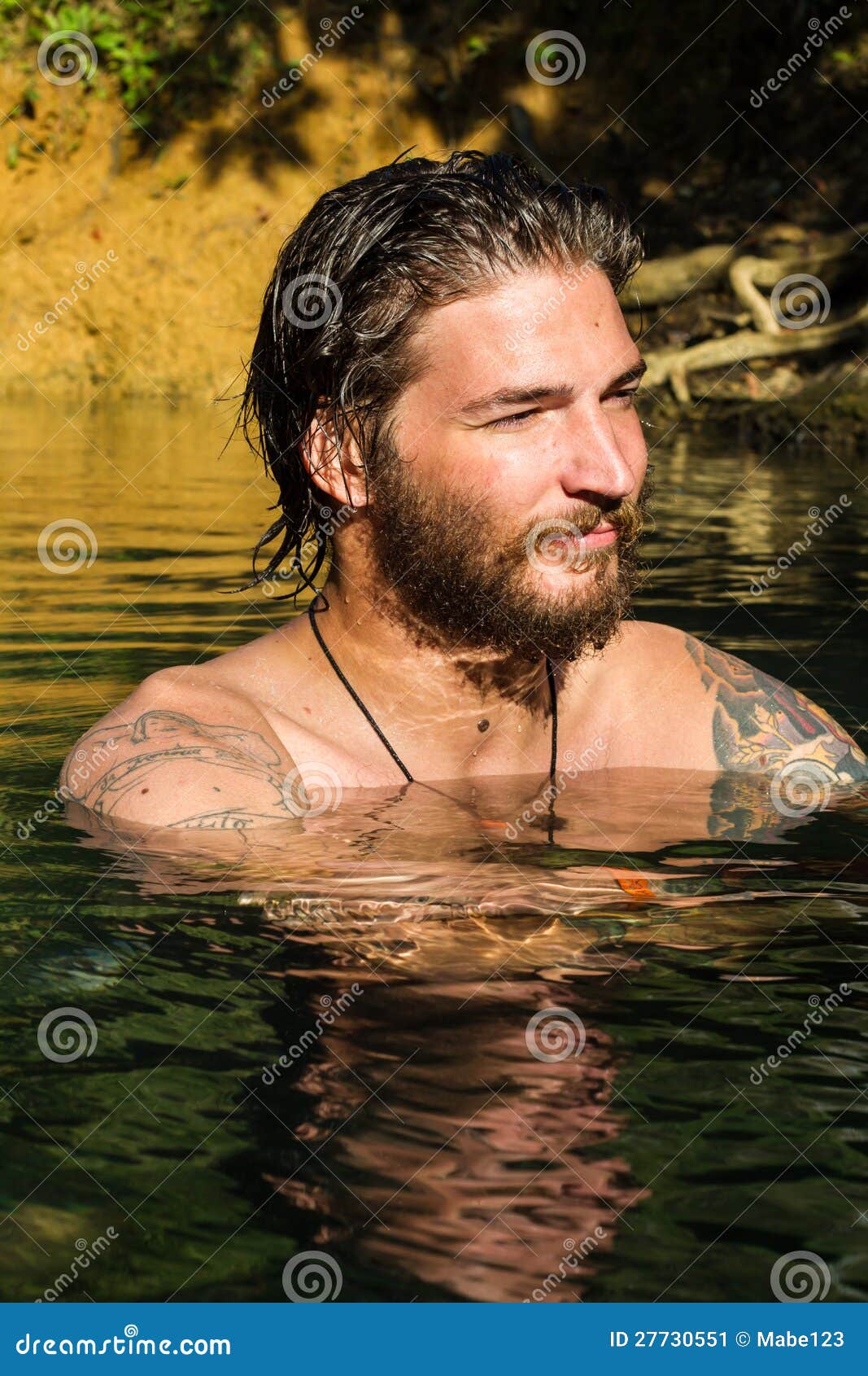 Young man in water stock image. Image of closeup, looking - 27730551