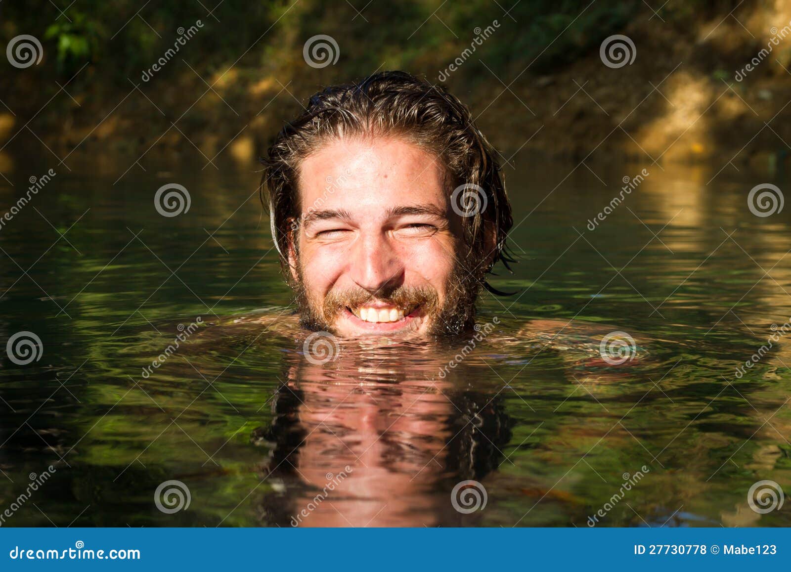 Young man in water stock photo. Image of portrait, beard - 27730778