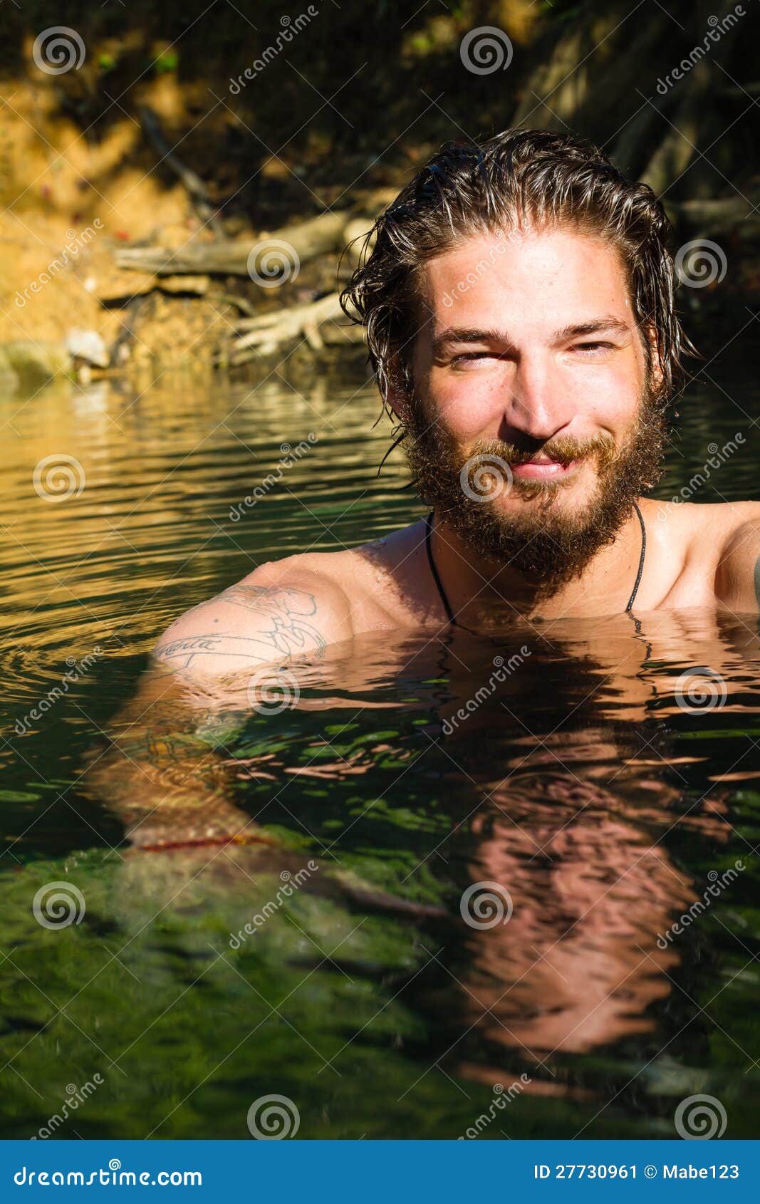 Young man in water stock image. Image of camera, water - 27730961