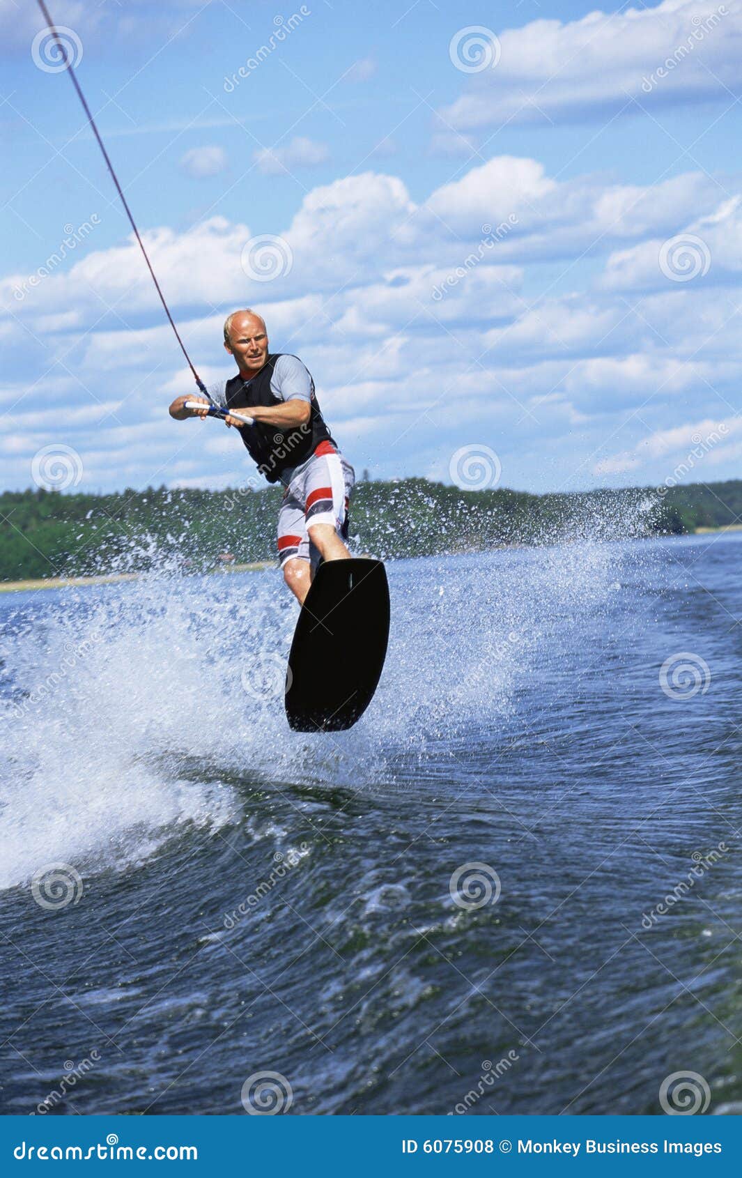 A young man water skiing stock photo. Image of adult, skiing - 6075908
