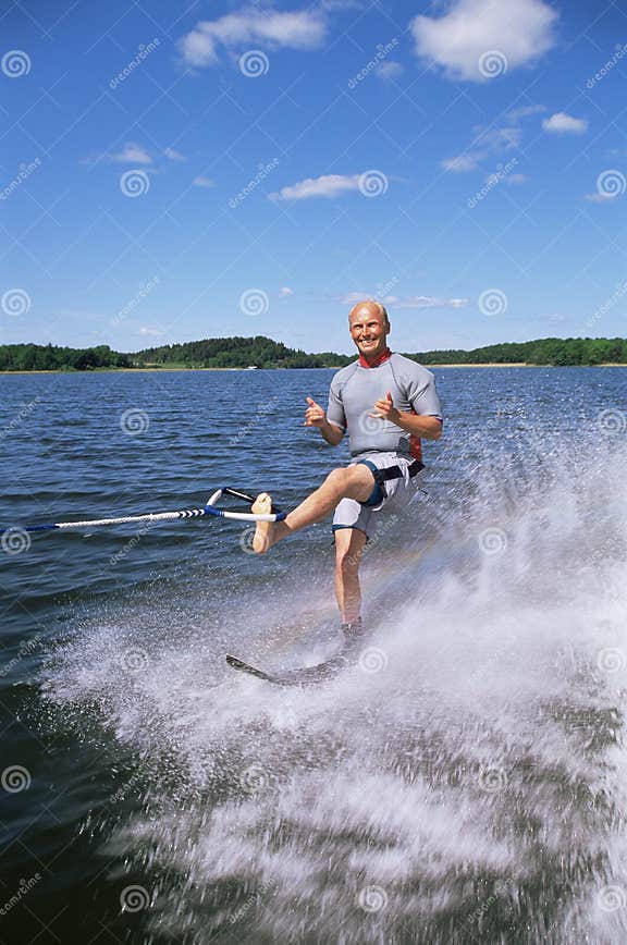 A young man water skiing stock photo. Image of enjoyment - 6075968