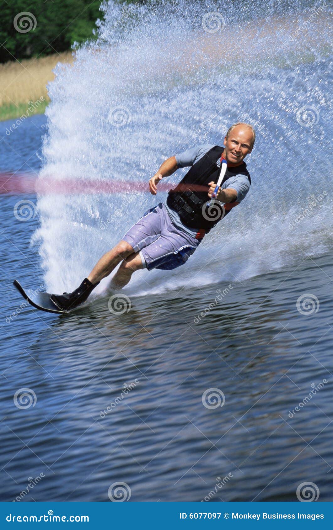 A young man water skiing stock image. Image of excitement - 6077097