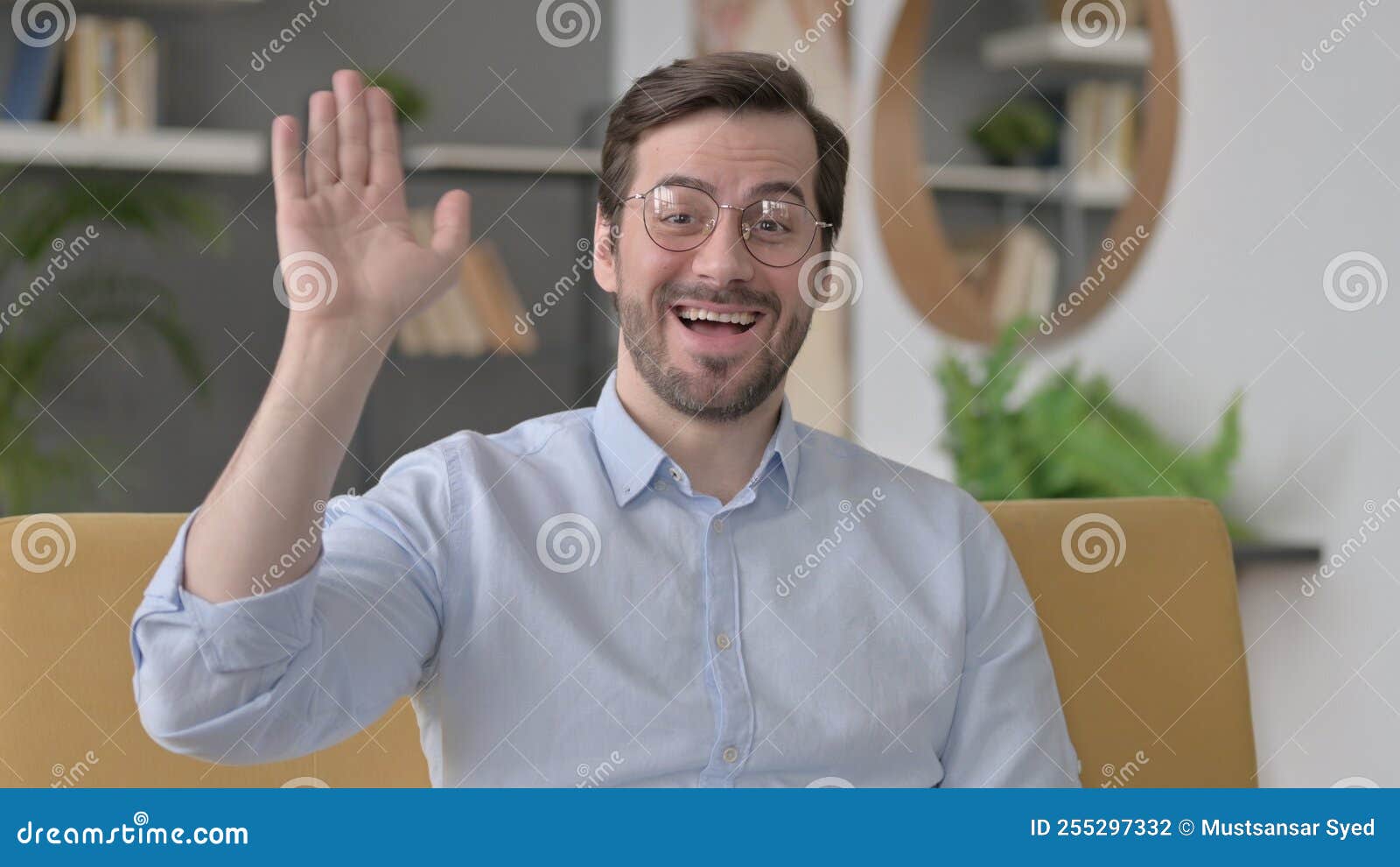Young Man Waving Hand Fo Video Call Stock Photo - Image of time ...