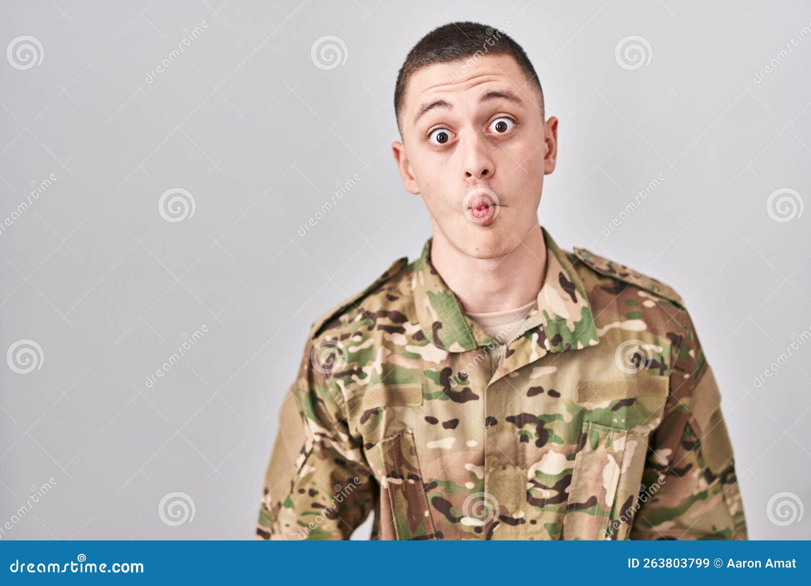Young Man Wearing Camouflage Army Uniform Making Fish Face with Lips ...