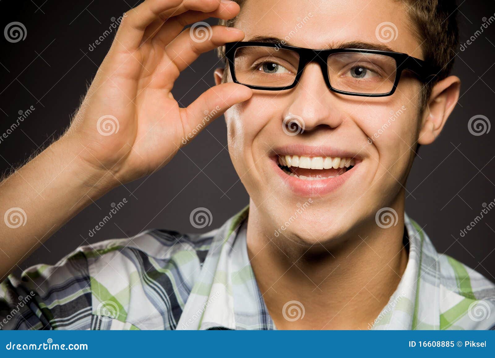 Young man wearing glasses stock image. Image of holding - 16608885