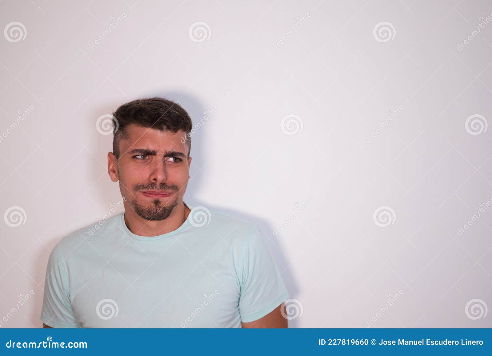 Young Man on a White Background Looking Disappointed and Disappointed ...