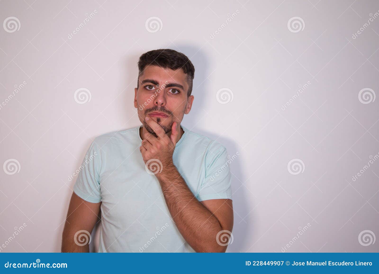 Young Man on a White Background Looking Disappointed and Disappointed ...