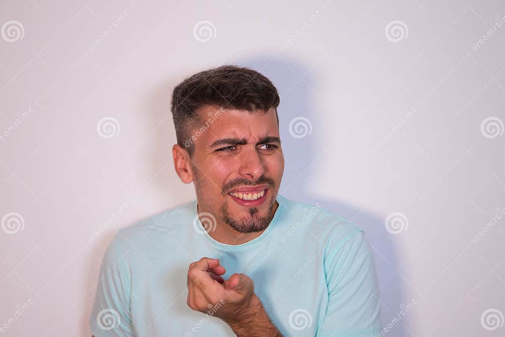 Young Man on White Background Looking with Questioning Face. Concept ...