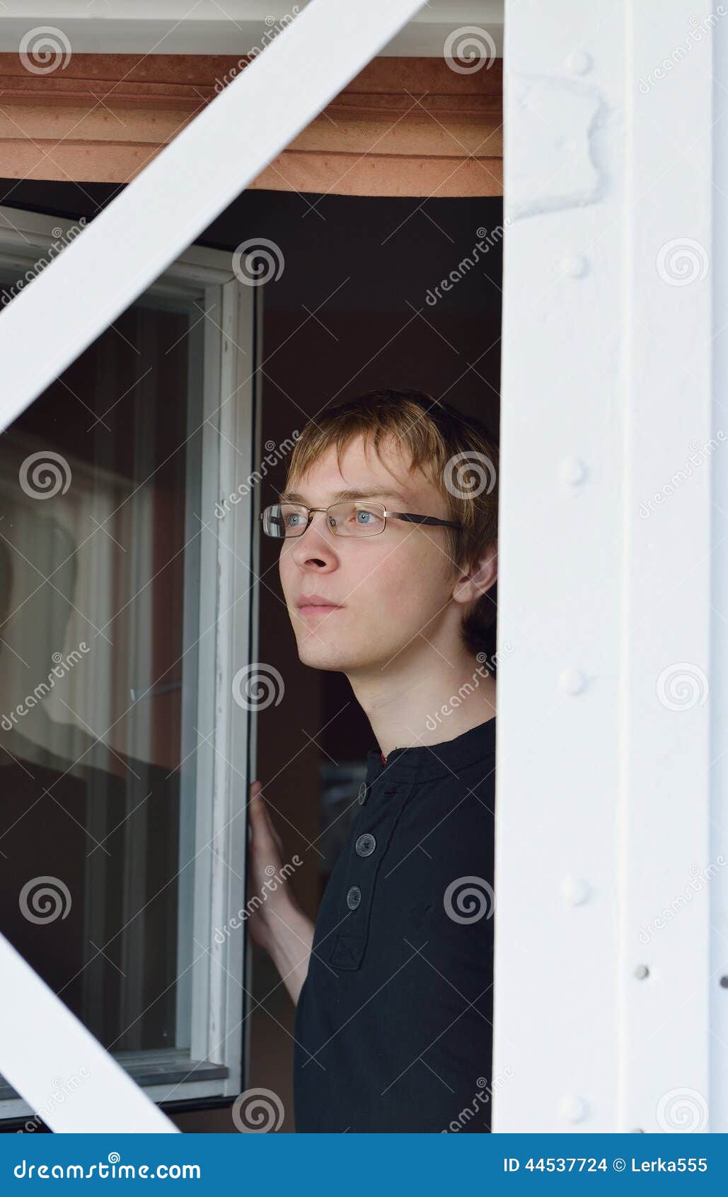 Young man in window stock photo. Image of portrait, beautiful - 44537724