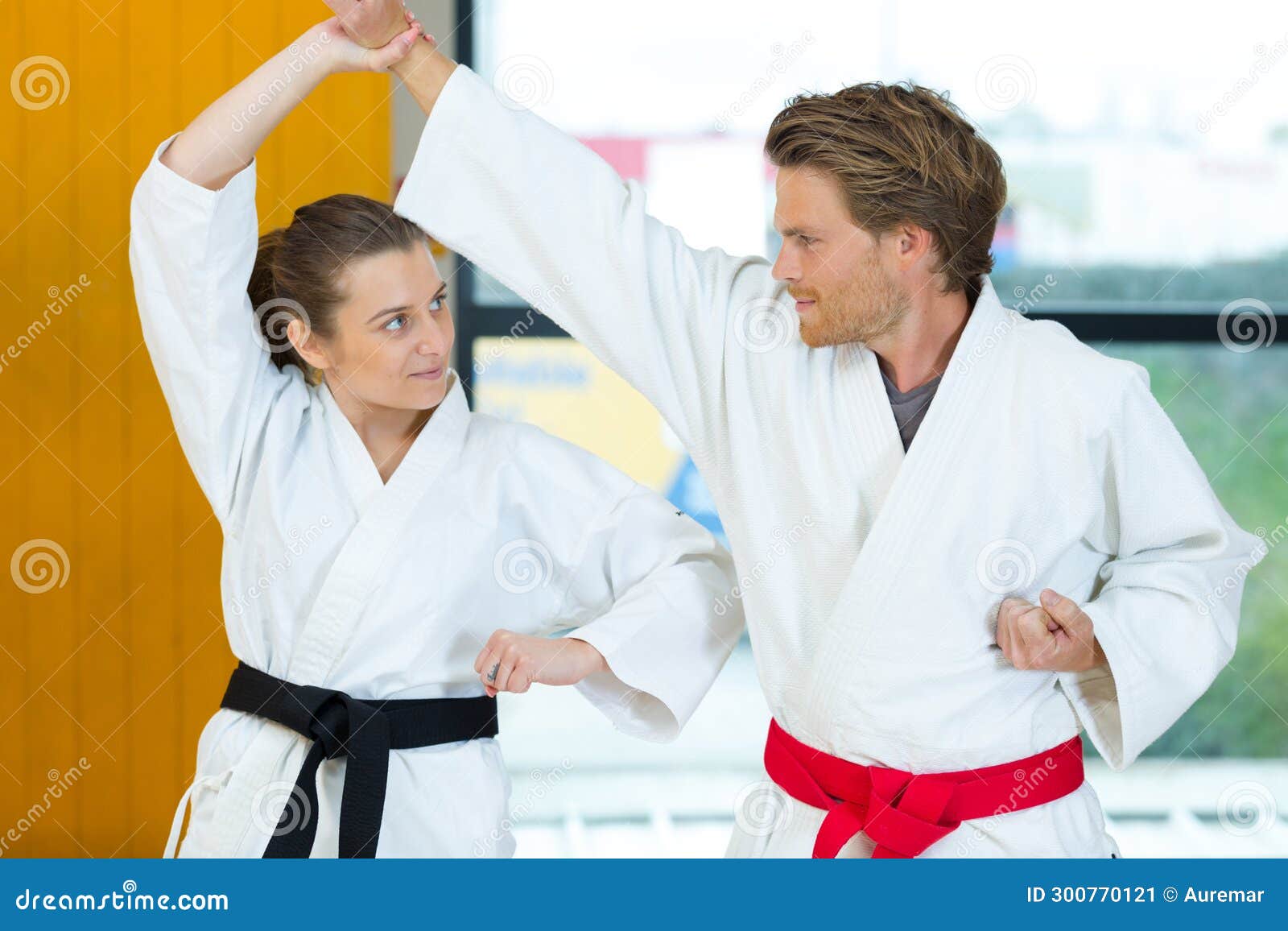 Young Man and Woman Practicing Karate in Dojo Stock Image - Image of ...