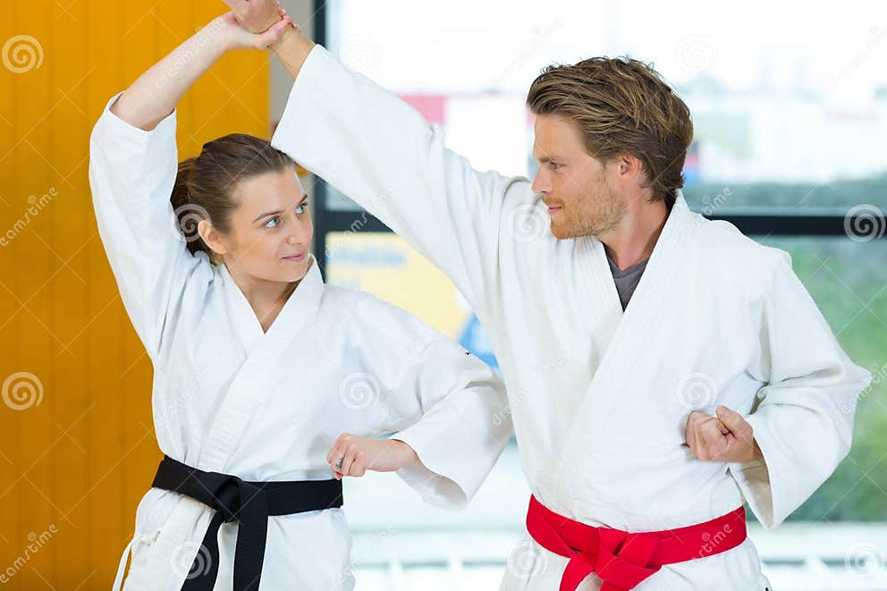 Young Man and Woman Practicing Karate in Dojo Stock Image - Image of ...