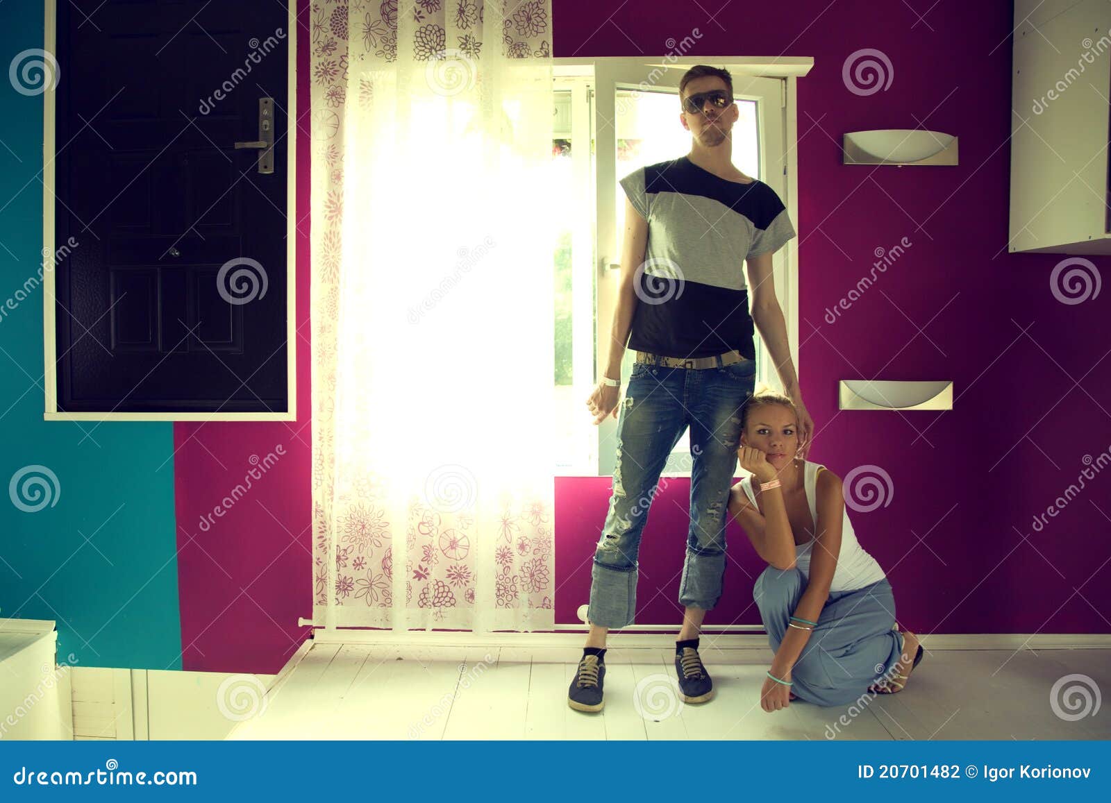 Young Man and Woman in Purple Room Stock Photo - Image of weird, floor ...