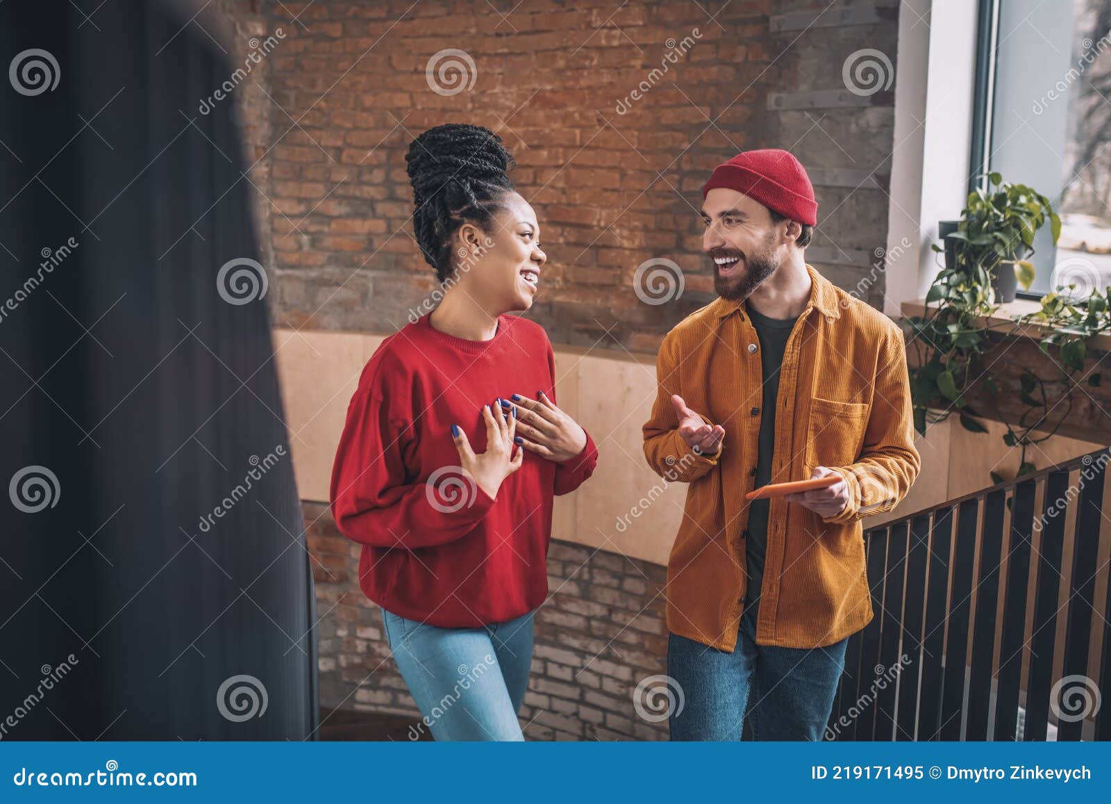 Young Man and a Woman Talking and Looking Interested Stock Image ...