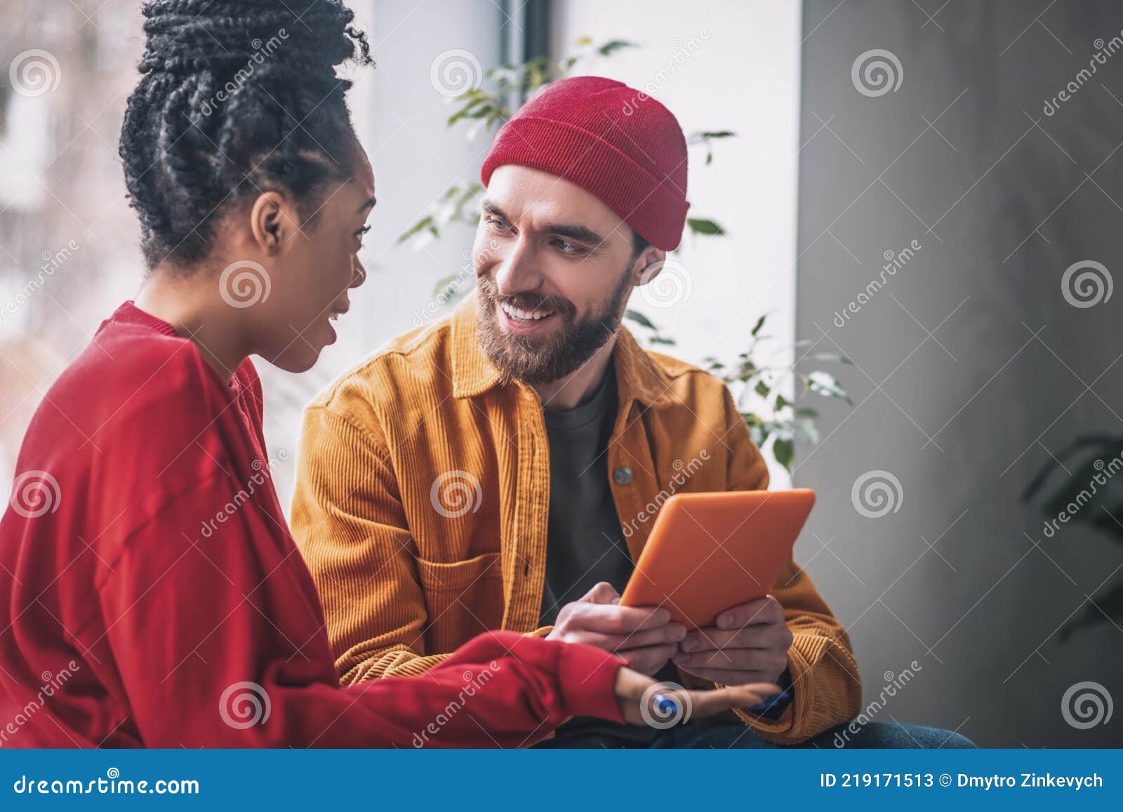Young Man and a Woman Talking and Looking Interested Stock Image ...
