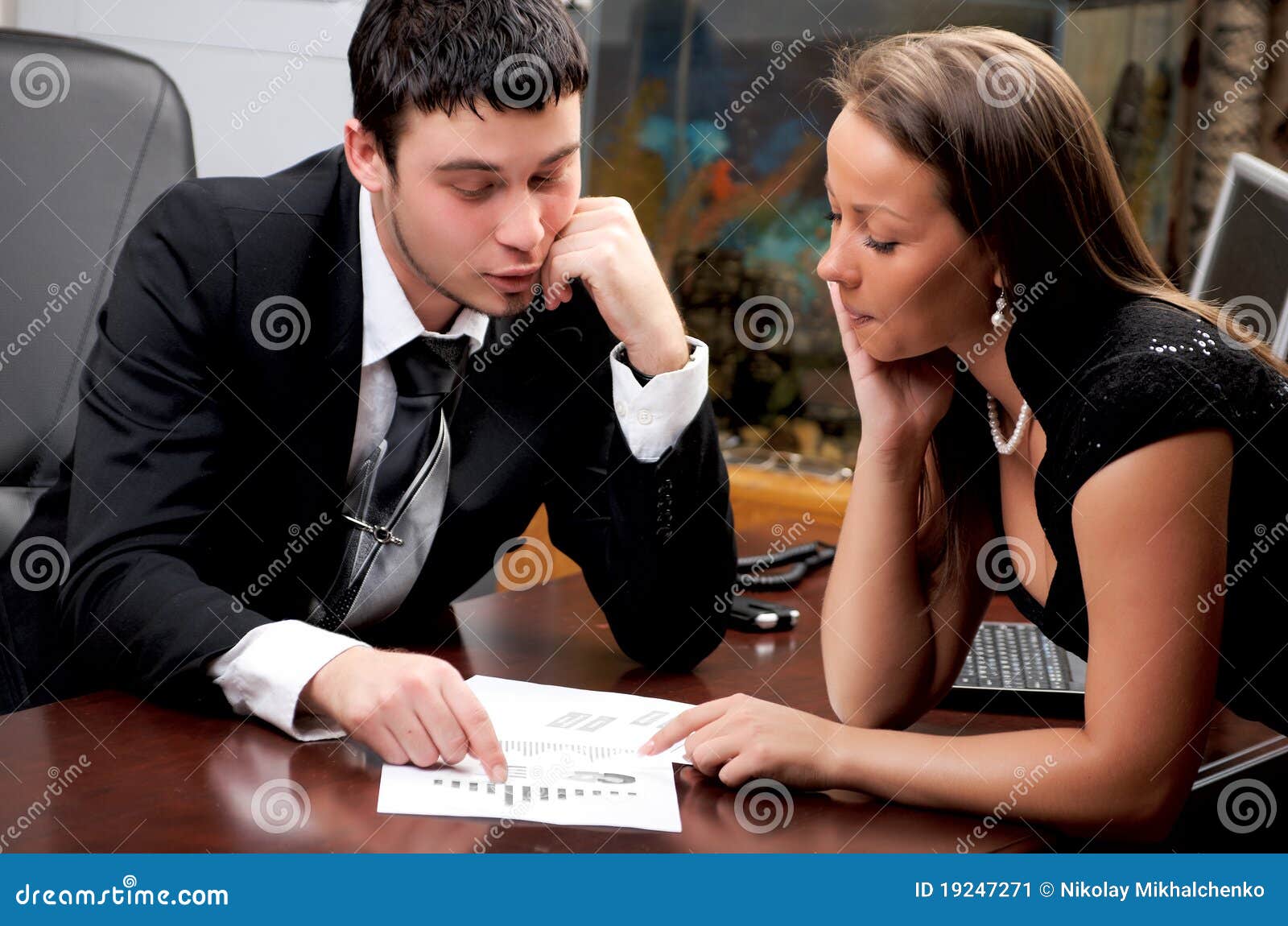 Young Man and Woman Working Together Stock Image - Image of desk, suit ...