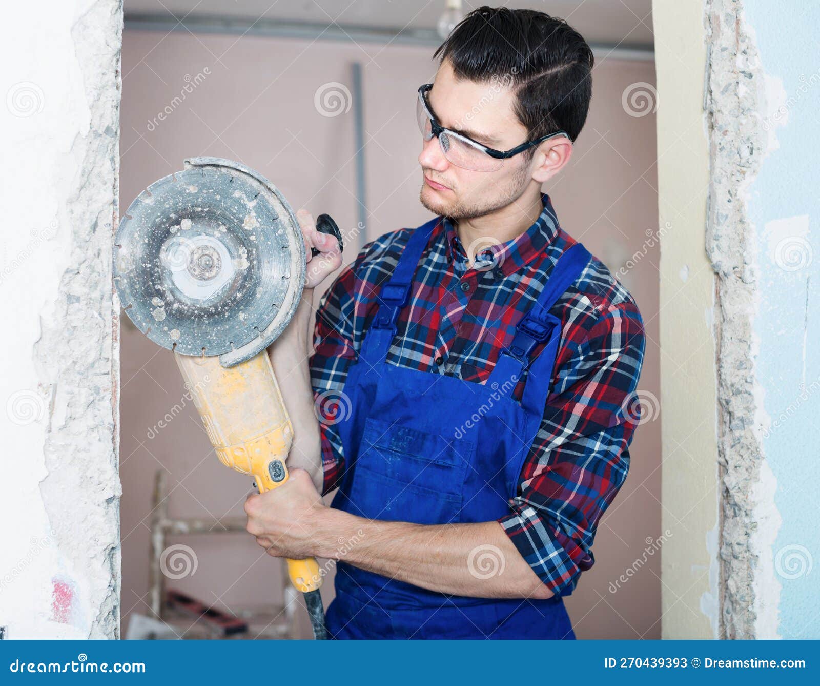 Young Man Worker Using Professional Angle Grinder Stock Image - Image ...