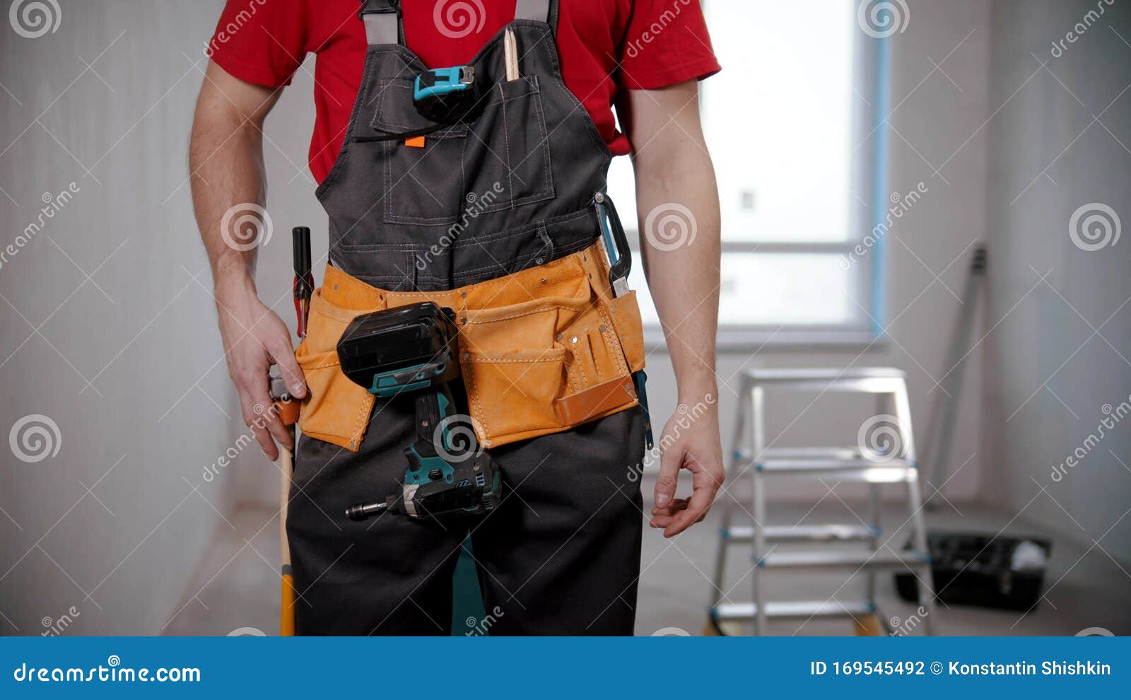 A Young Man Worker Wearing a Tool Belt Stock Photo - Image of ...