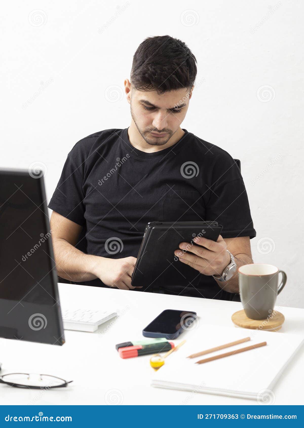 Young Man Working and Checking His Notebook in His Home Office ...