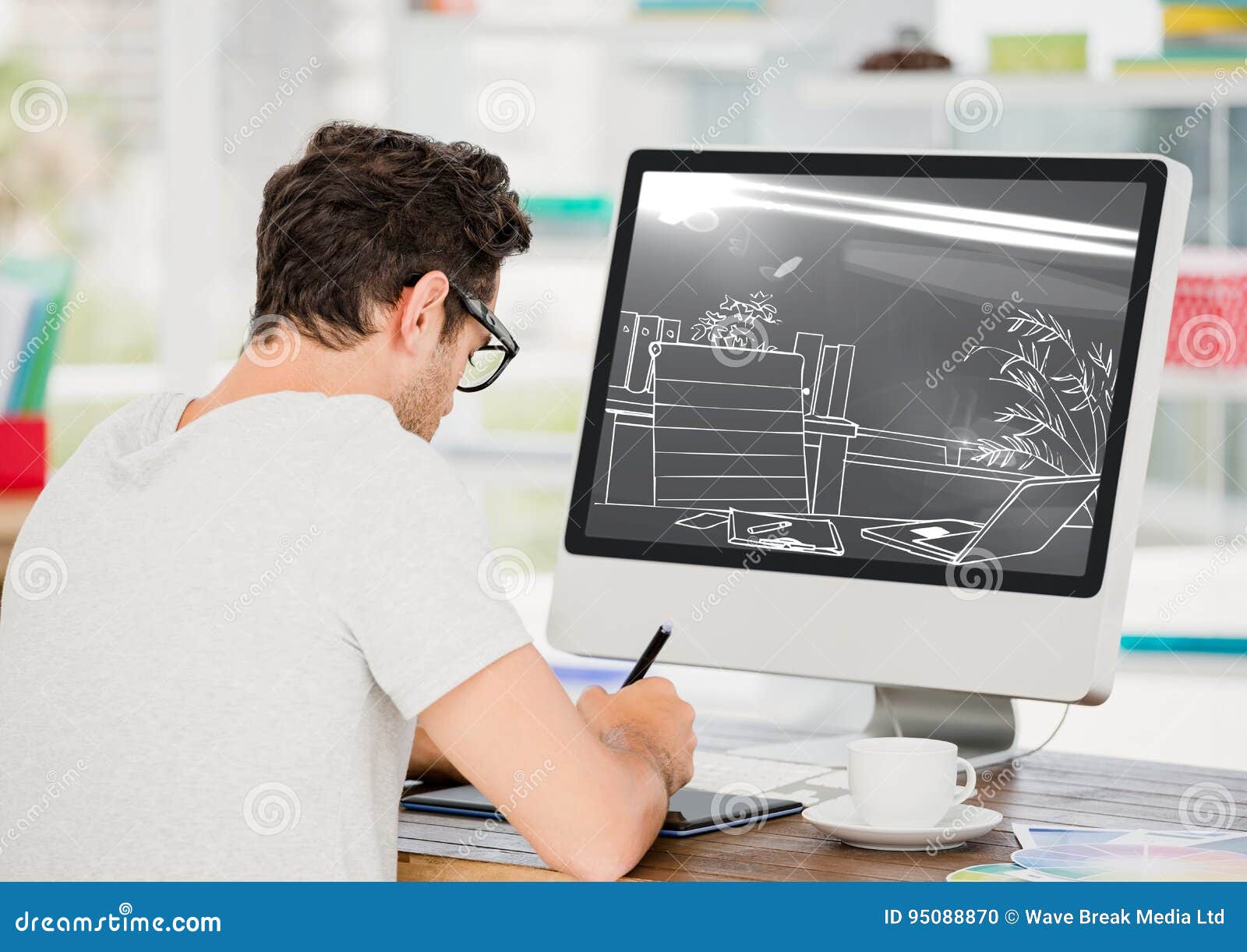 Young Man Working in on the Computer on the Design of the New Office ...