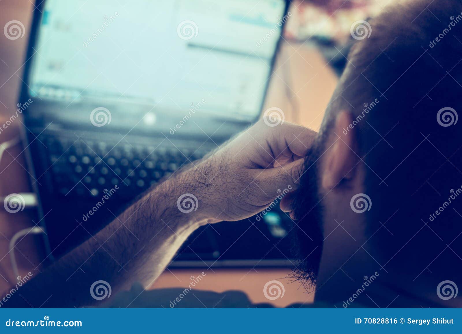 Young Man Working At A Computer, Home Office, Blurred Background Stock ...