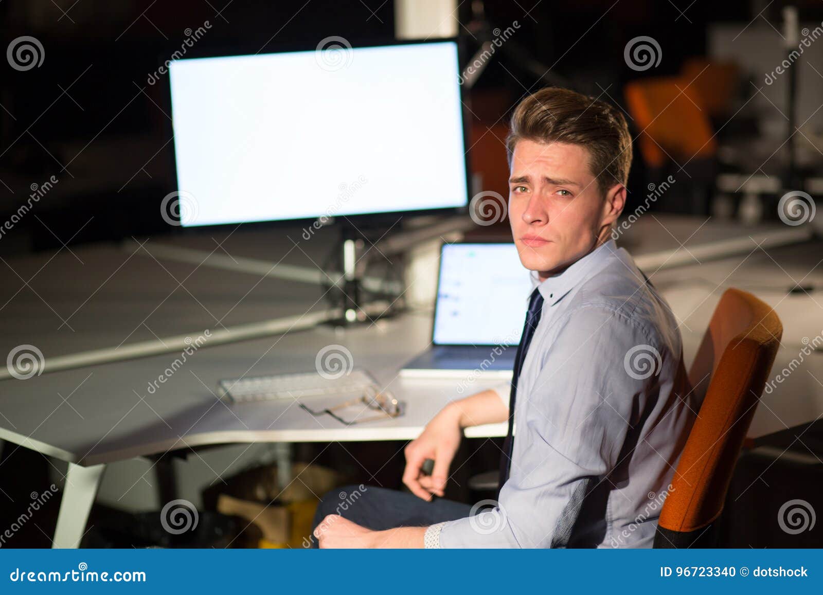 Man Working on Computer in Dark Office Stock Photo - Image of people ...
