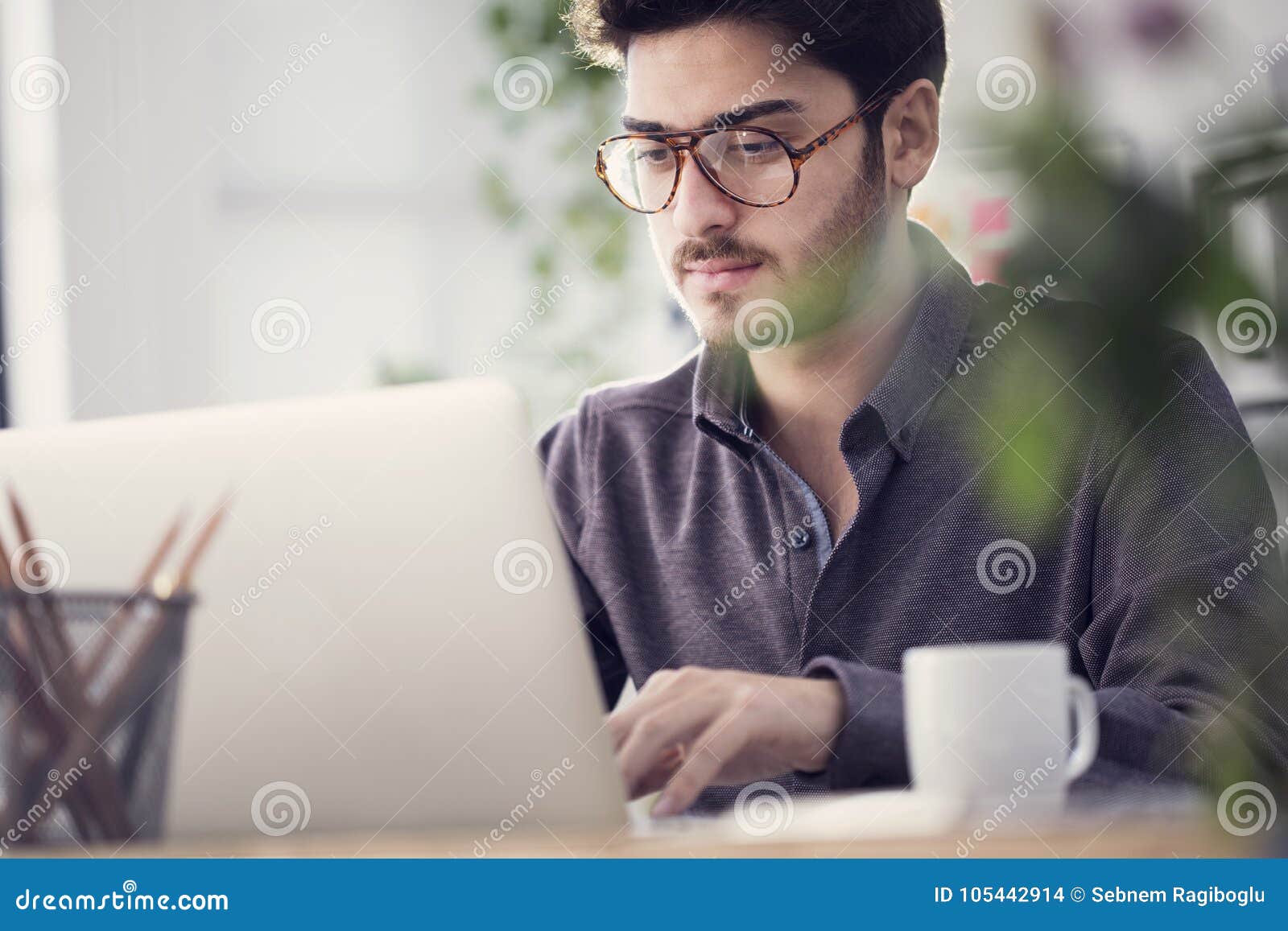 Young Man Working on Computer Stock Photo - Image of worker, confident ...