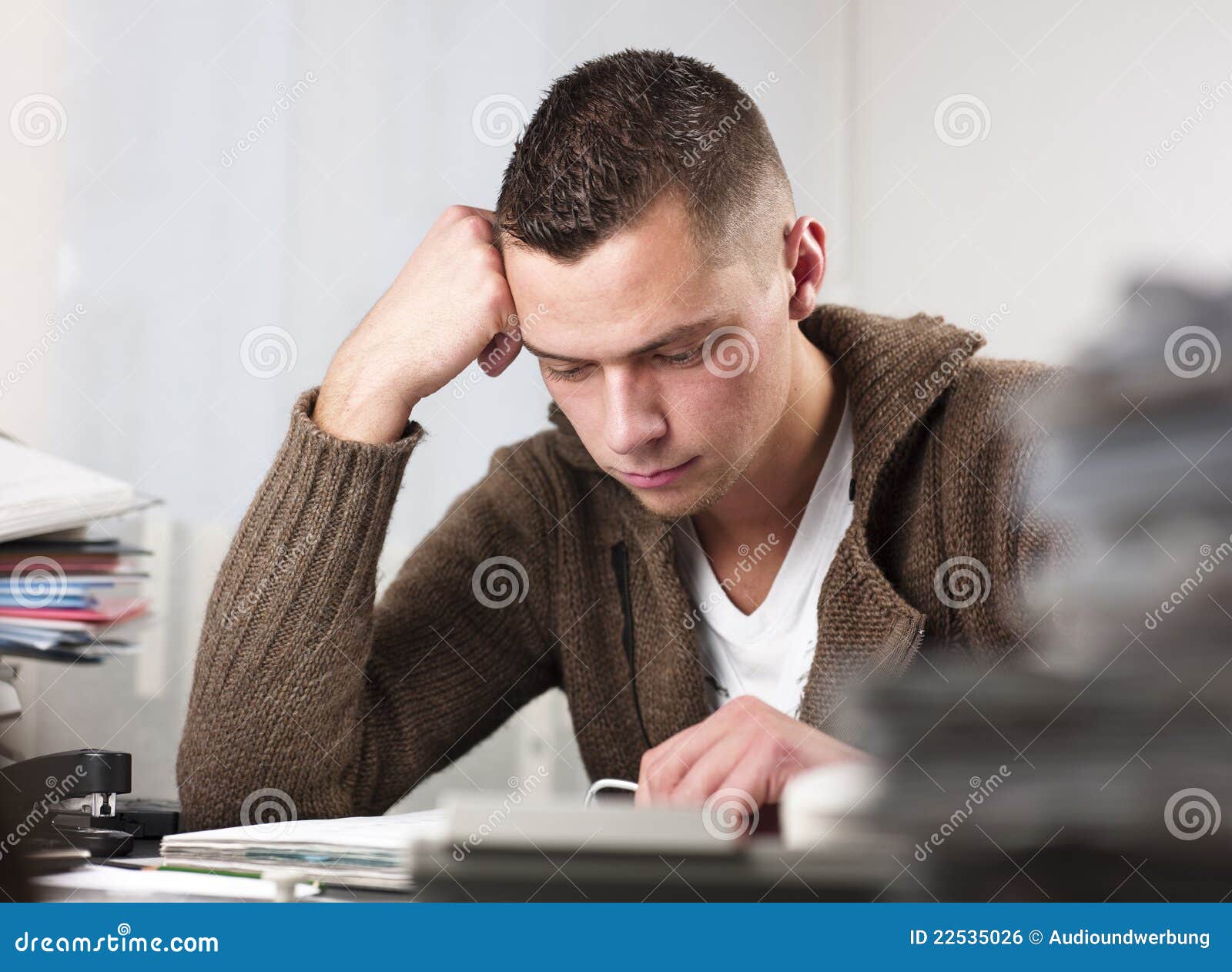 Young man working at desk stock photo. Image of folders - 22535026