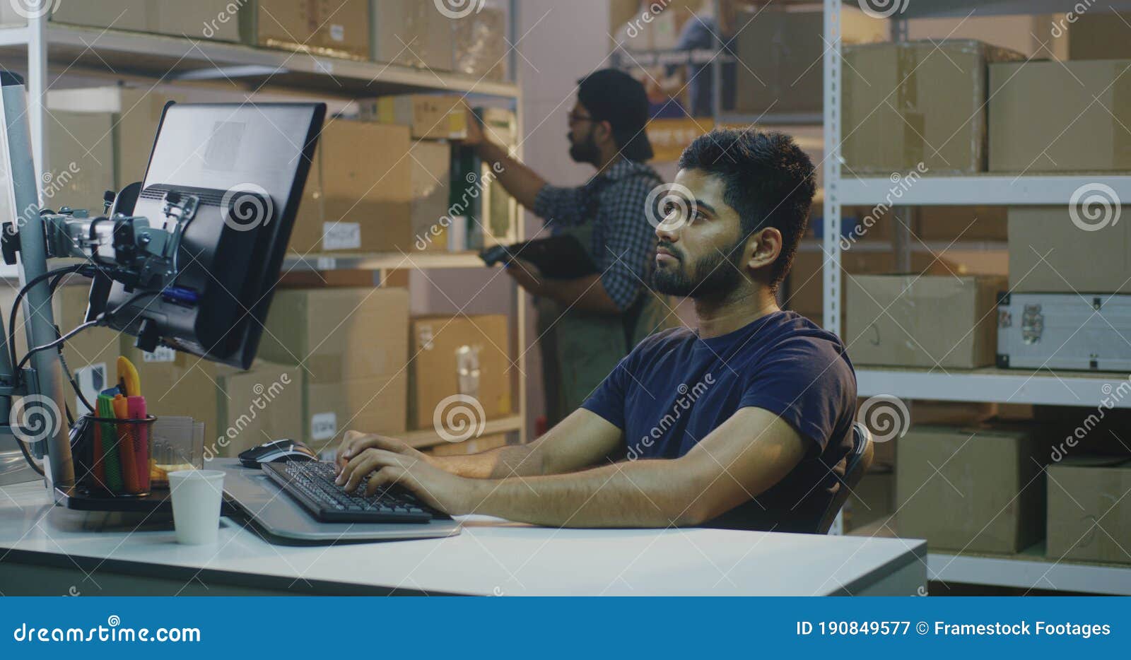 Young Man Working in Distribution Center Stock Image - Image of ...