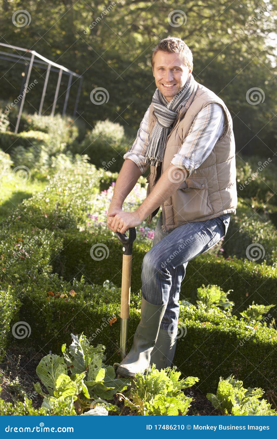 Young Man Working in Garden Stock Photo - Image of cultivating, smiling ...