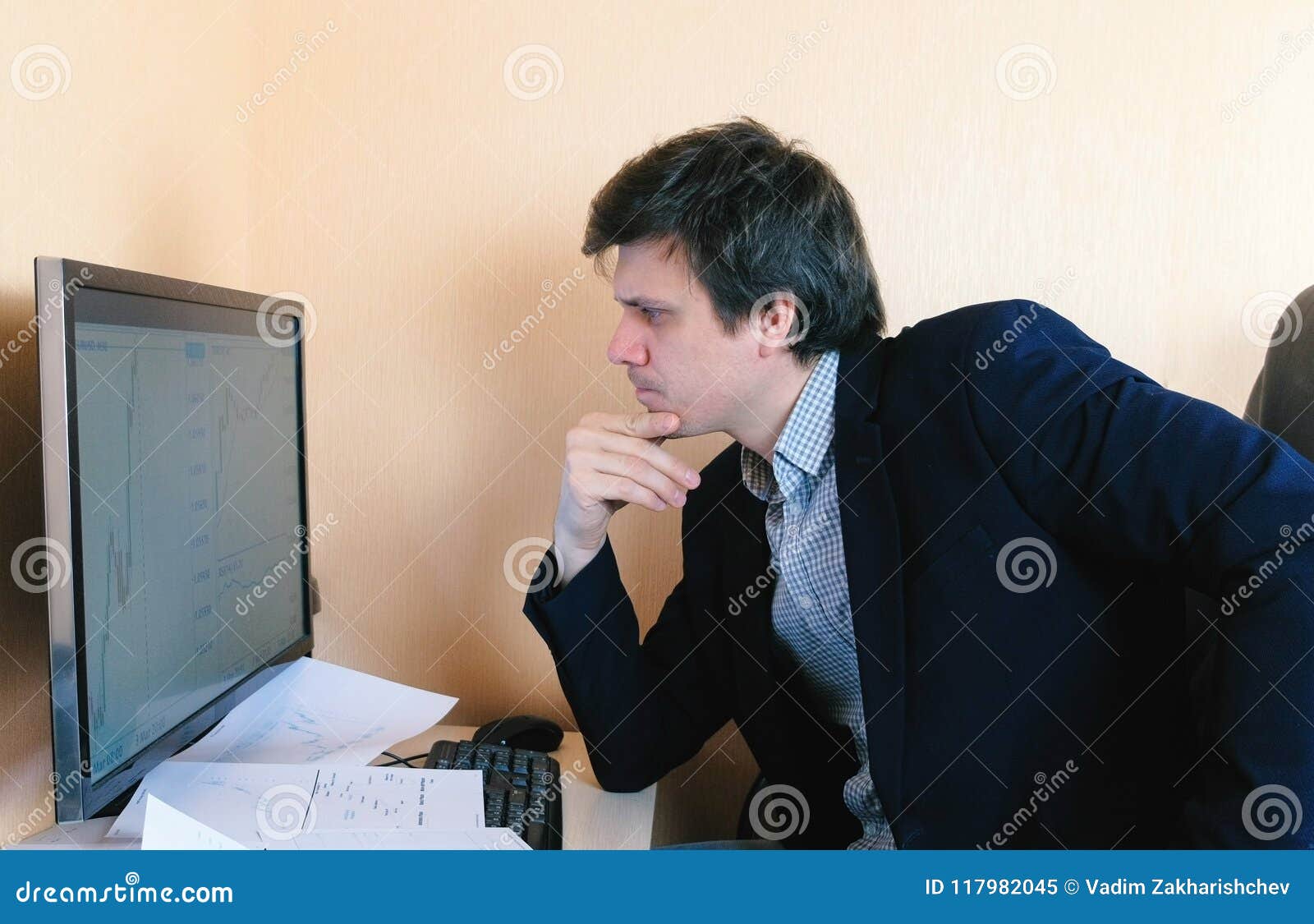 Young Man is Working Hard Behind the Computer. Stock Image - Image of ...