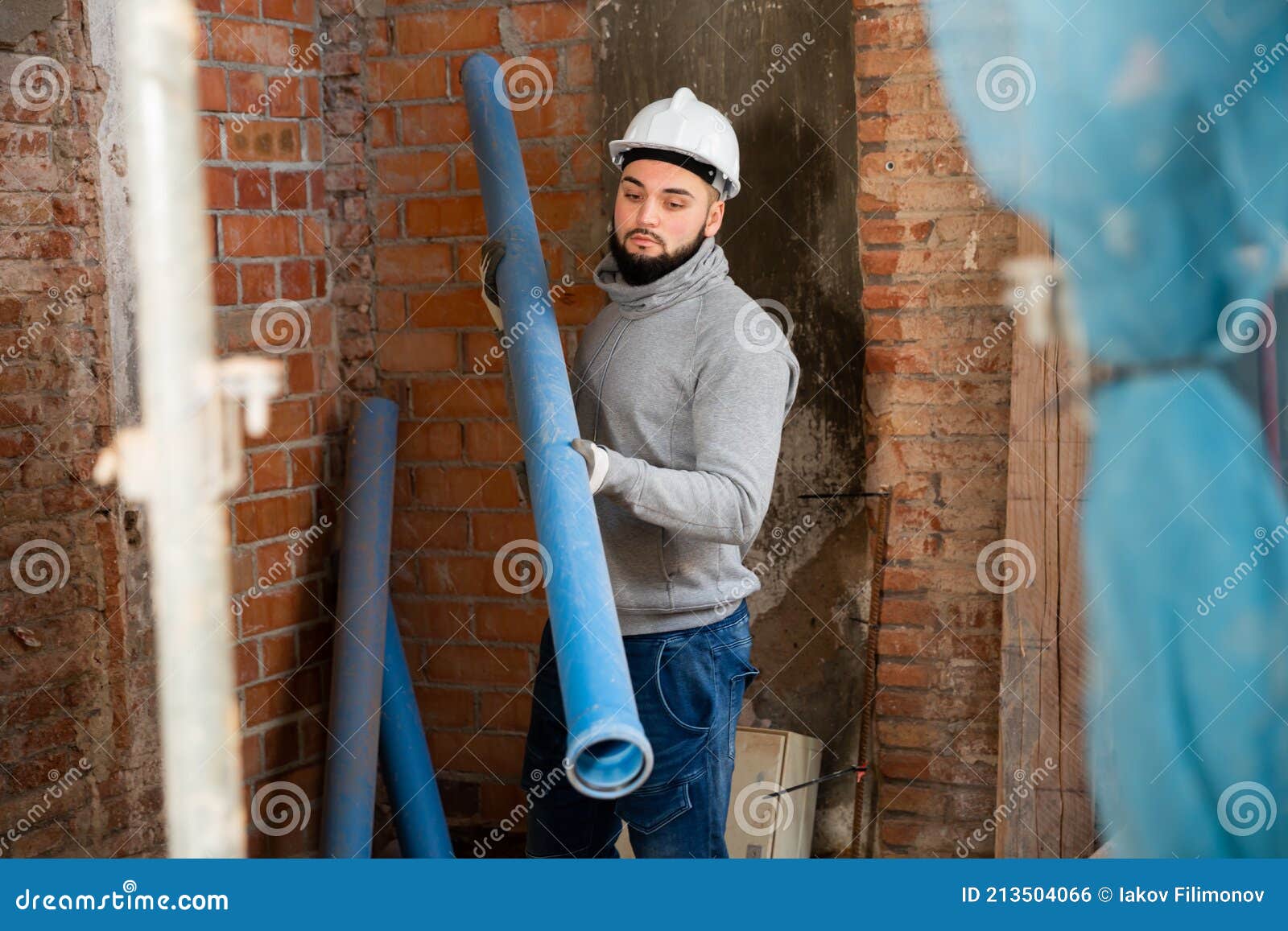 Young Man Assembling Plastic Pipes Stock Photo - Image of builder ...