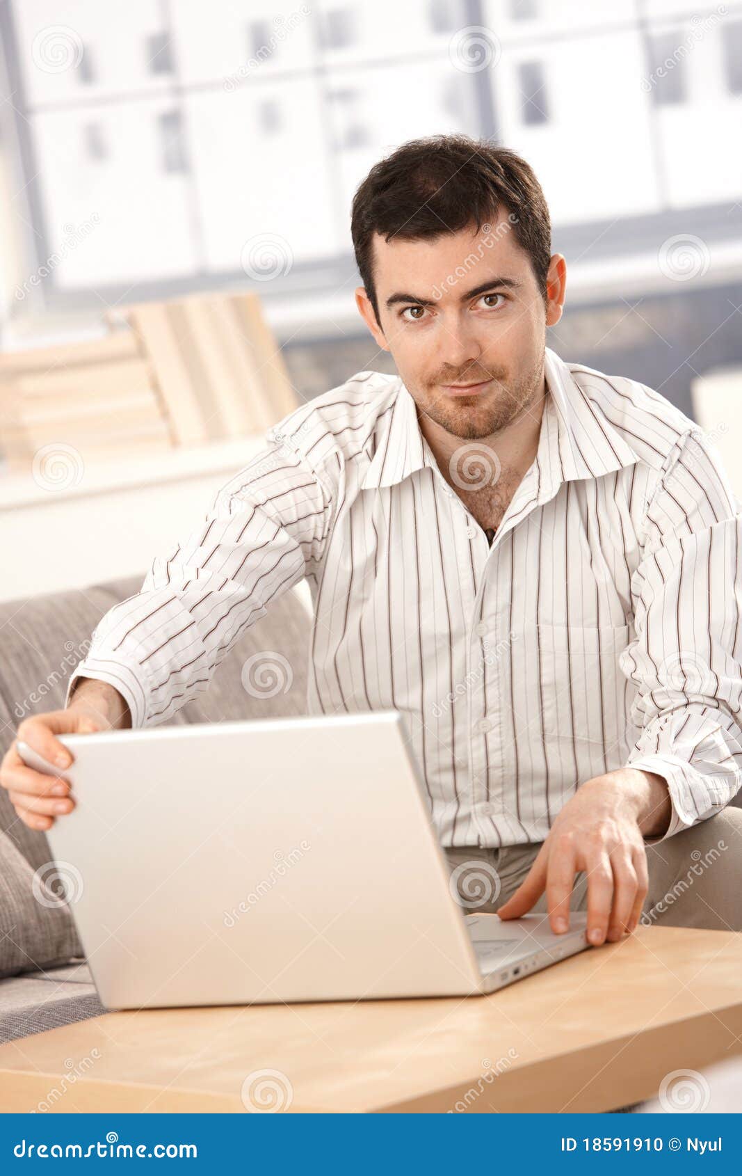 Young Man Working at Home Using Laptop Stock Photo - Image of domestic ...