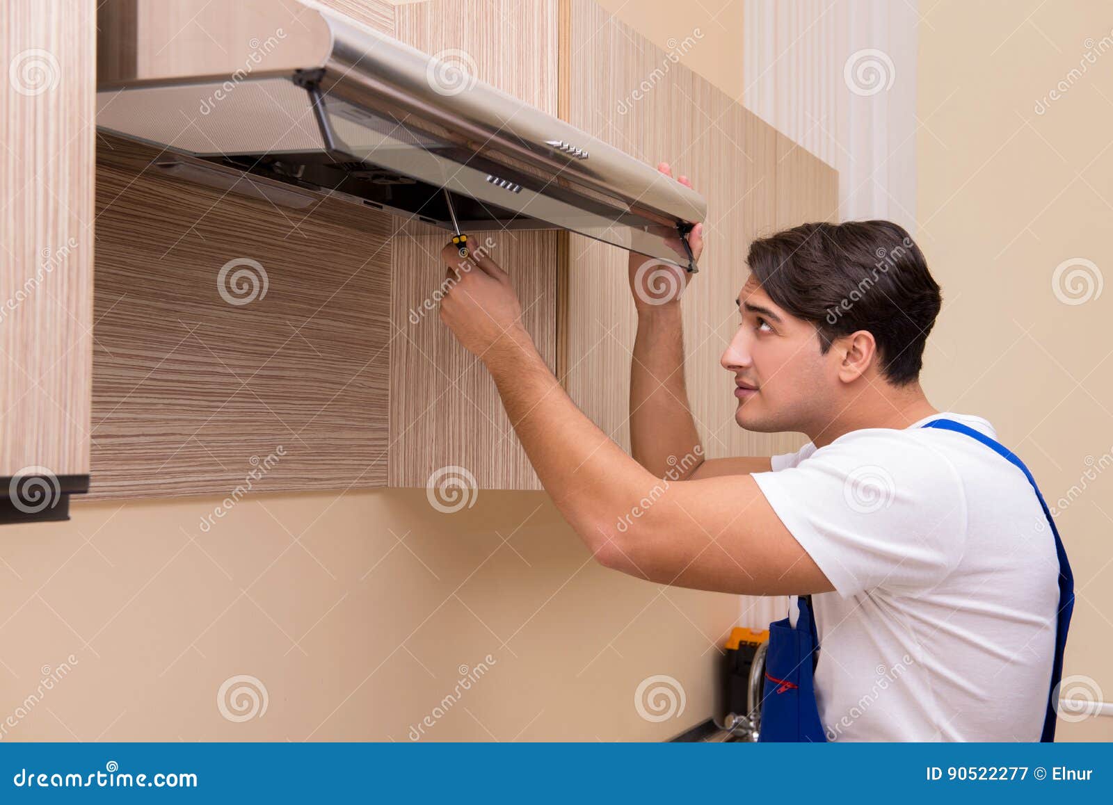 The Young Man Working with Kitchen Equipment Stock Image - Image of ...