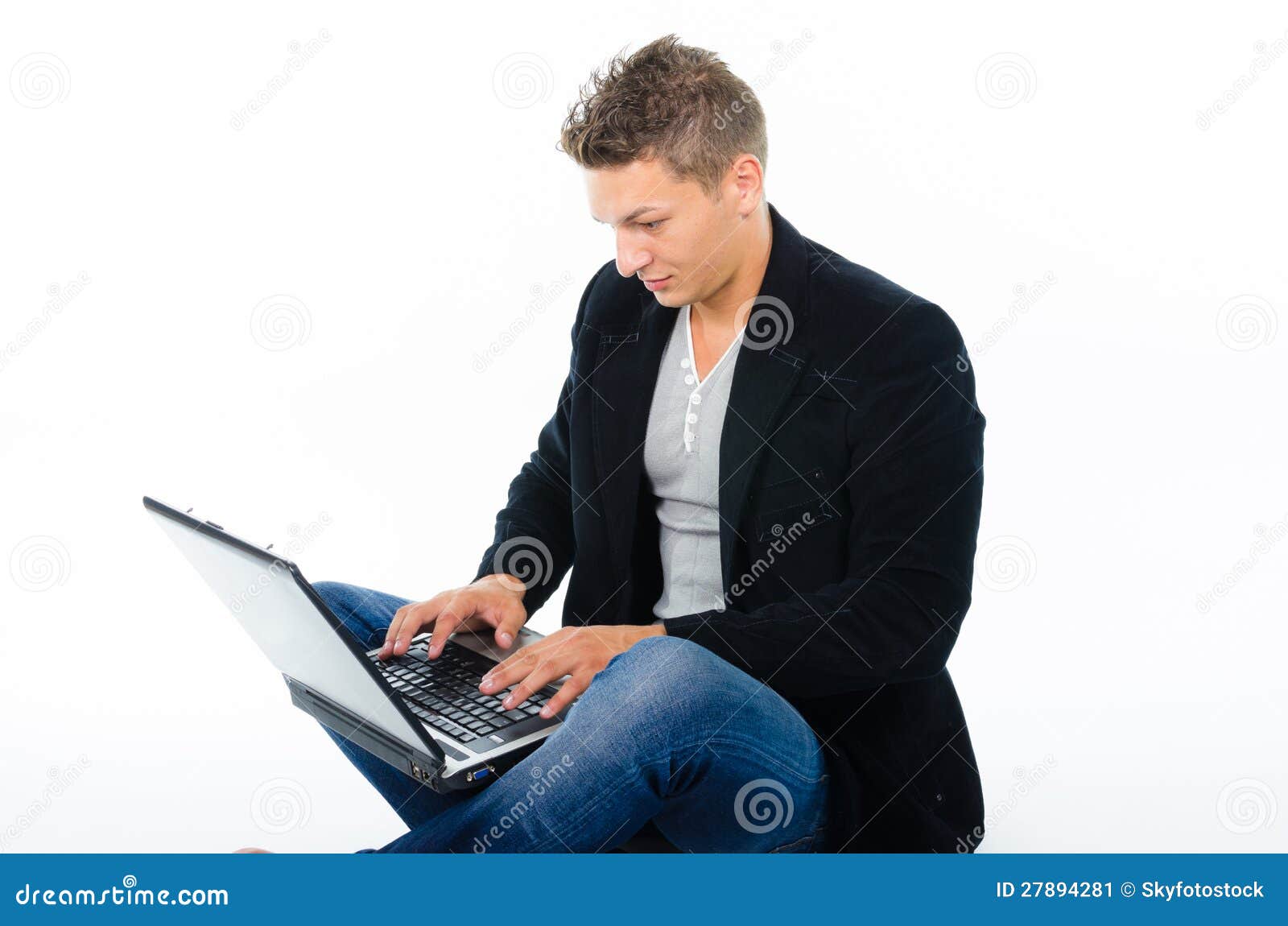Young Man Working at Laptop Stock Image - Image of male, notebook: 27894281