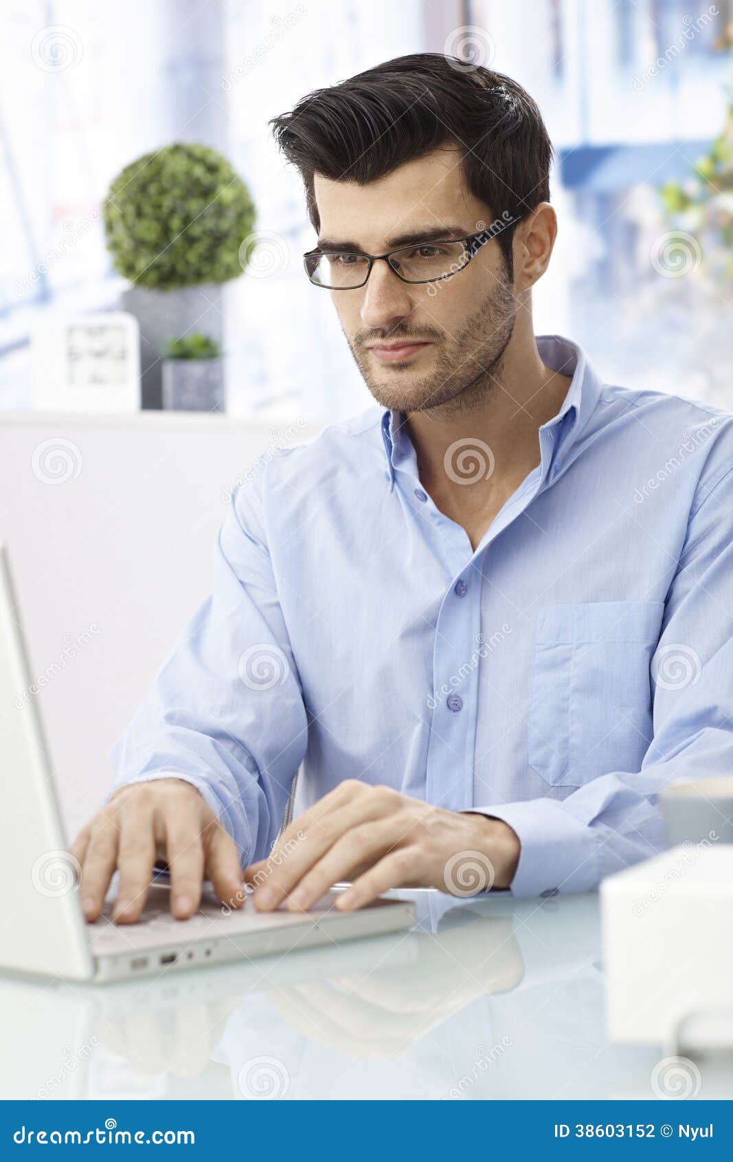 Young Man Working on Laptop Computer Stock Photo - Image of desk ...
