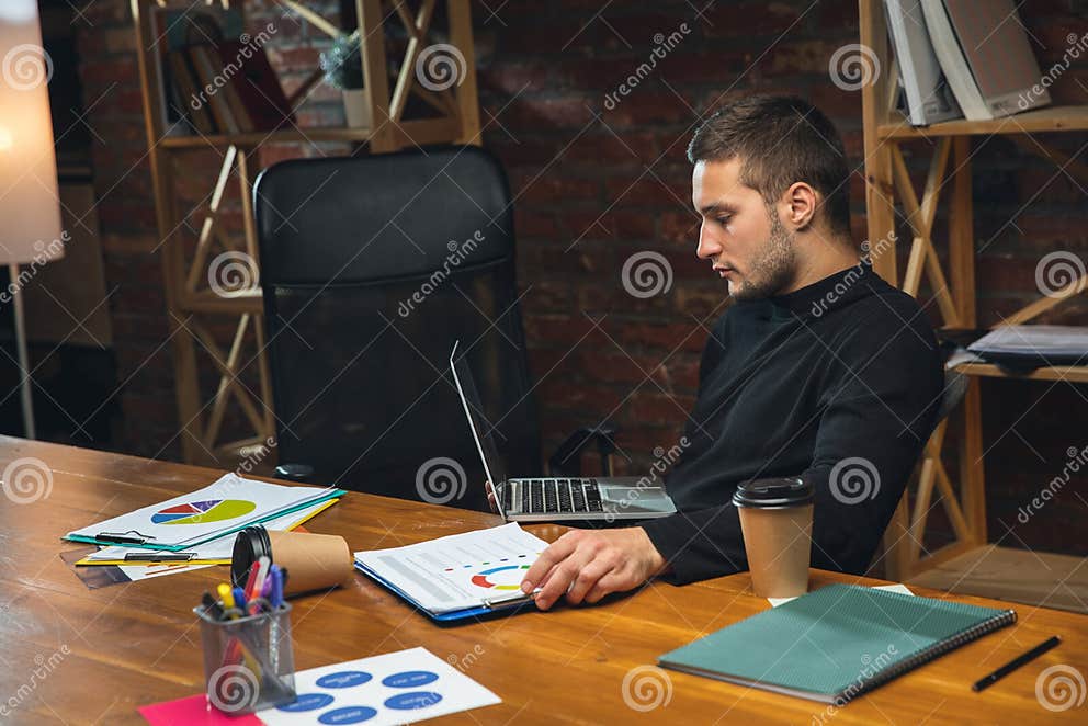 Young Man Working in Modern Office Using Devices and Gadgets. Making ...