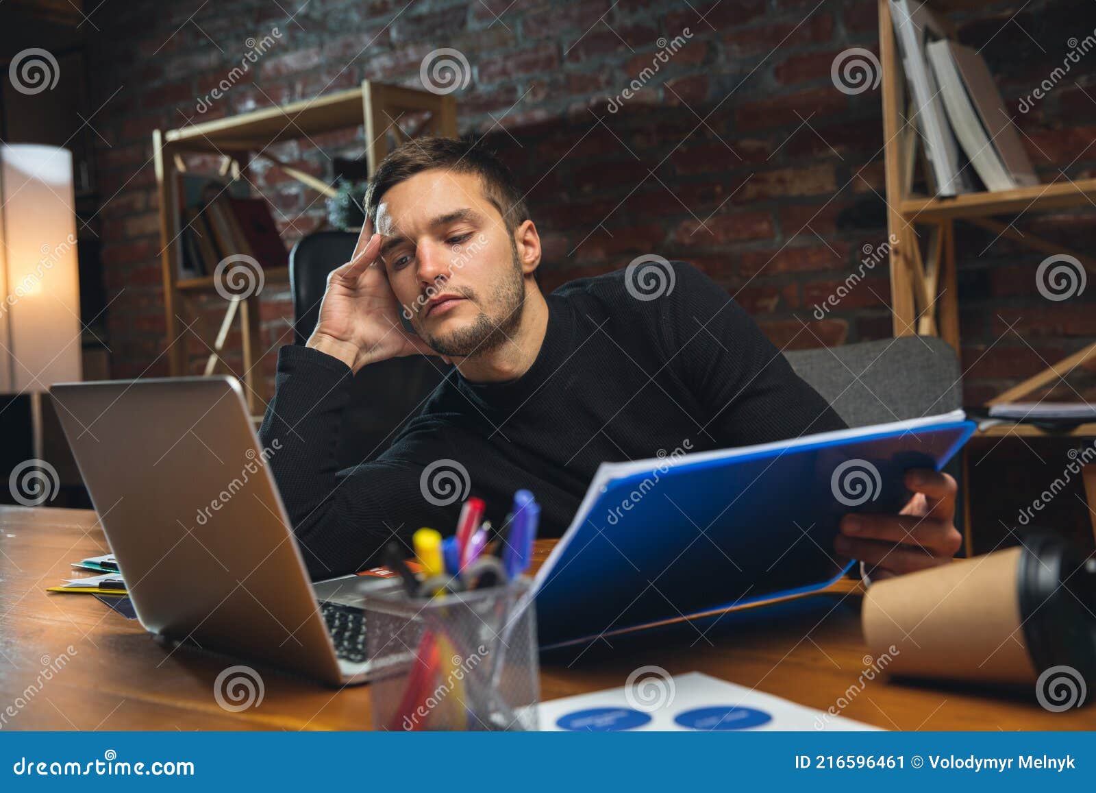 Young Man Working in Modern Office Using Devices and Gadgets. Making ...