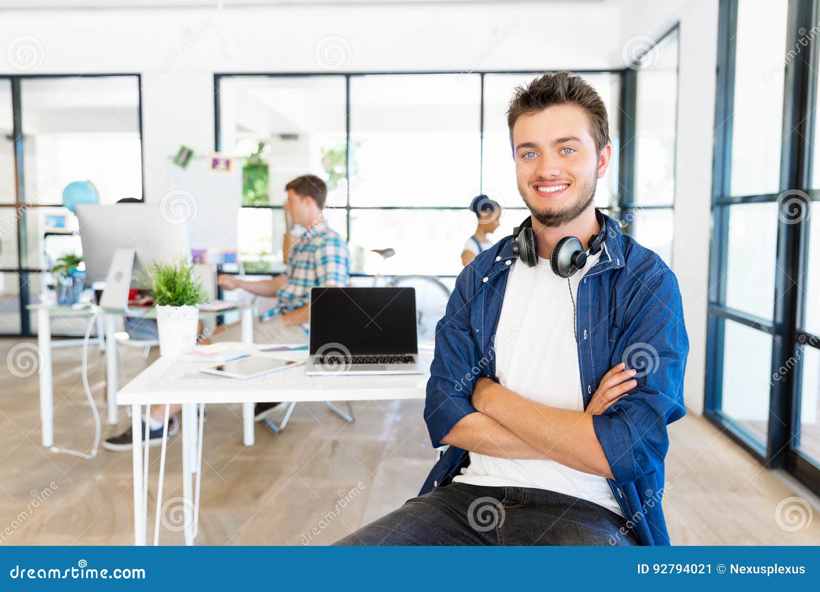 Young Man Working in Office Stock Image - Image of adult, person: 92794021