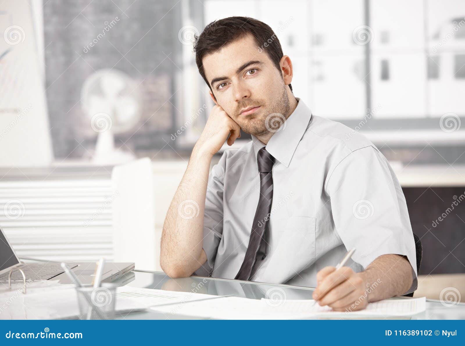 Young Man Working in Office Writing Notes Thinking Stock Photo - Image ...