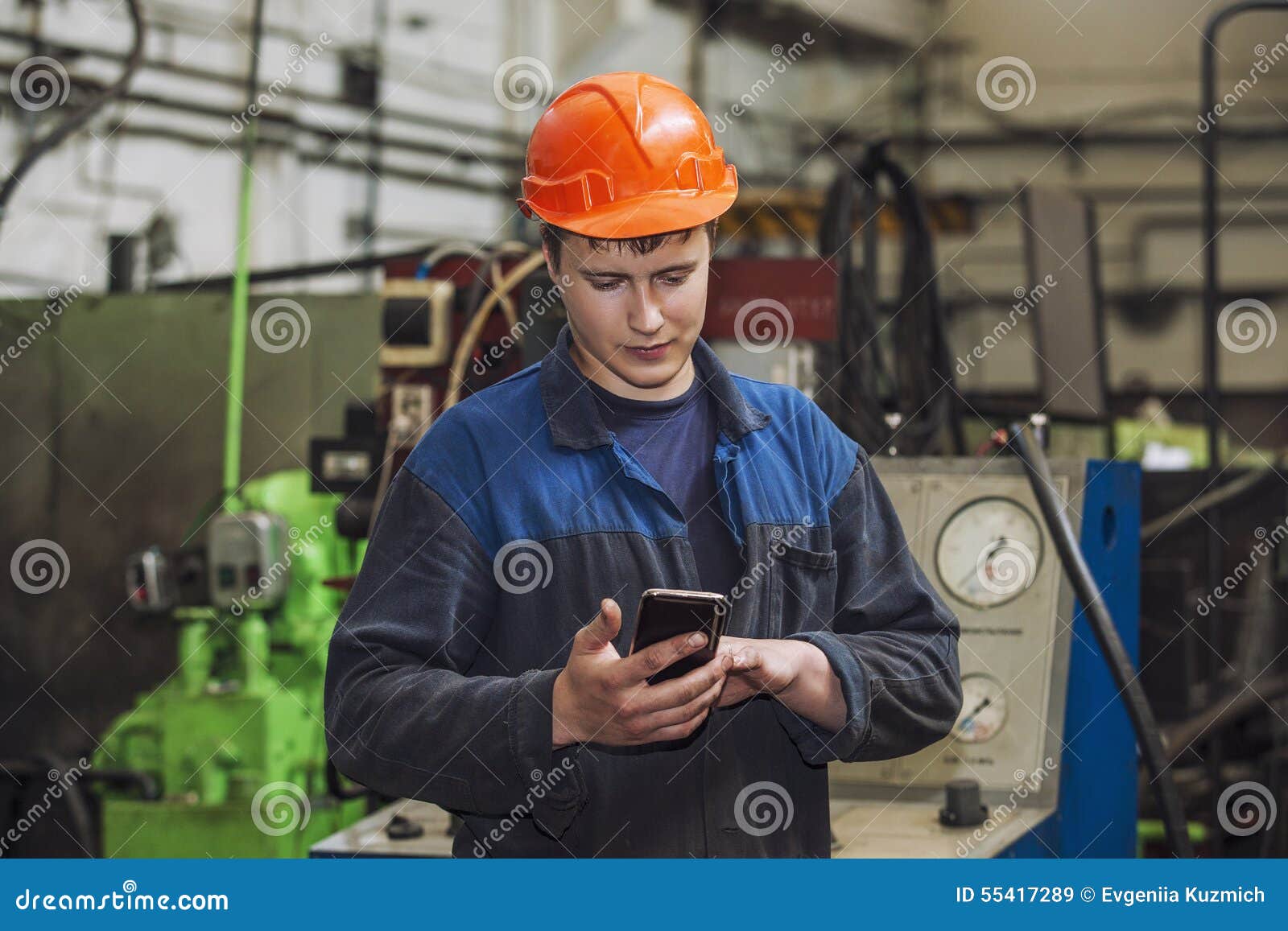 The Young Man Working at the Old Factory on Installation of Equipment ... The Young Man Working at the Old Factory on Installation of Equipment ...