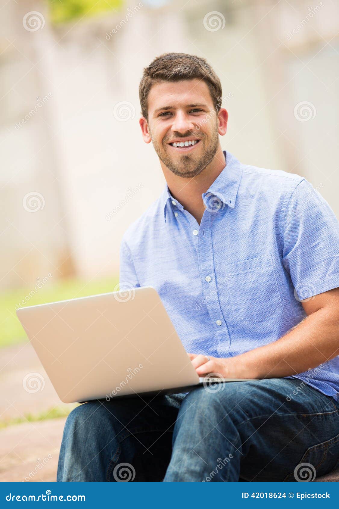 Young Man Working Outside on Laptop Stock Photo - Image of shirt ...