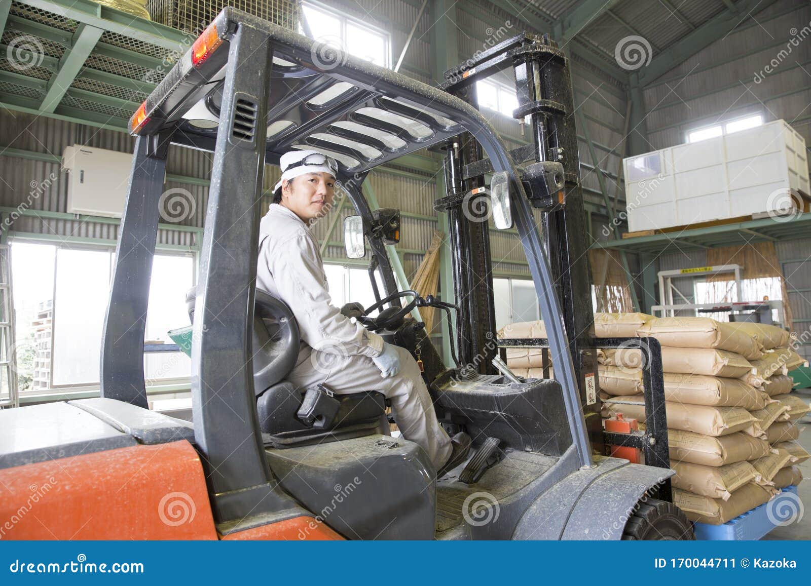 Young Man Working in Rice Mill Stock Image - Image of machine, time ...